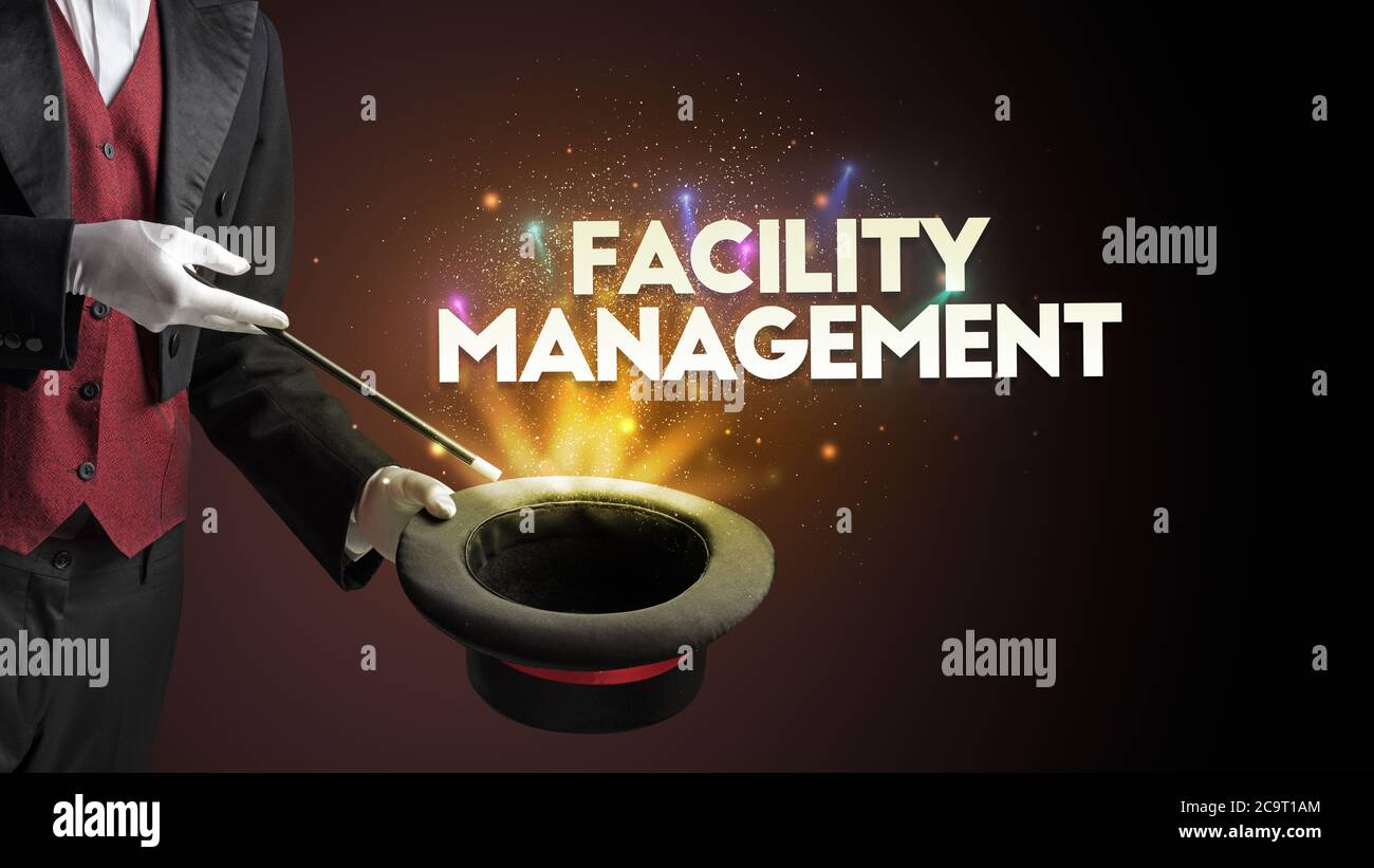 Illusionist is showing magic trick with FACILITY MANAGEMENT inscription ...