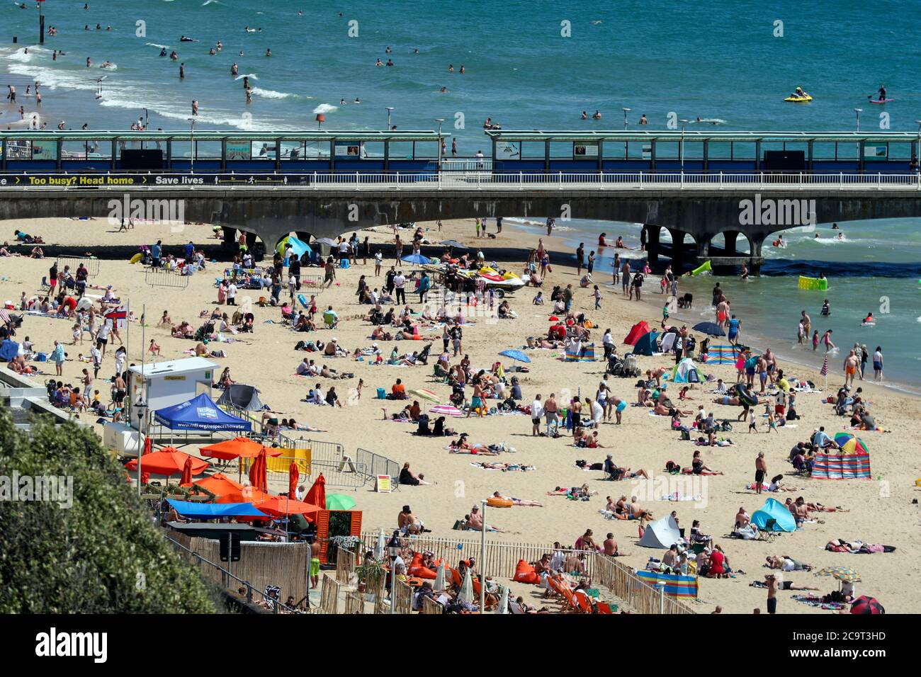 People on the beach at Bournemouth as the hot weather continues Stock ...