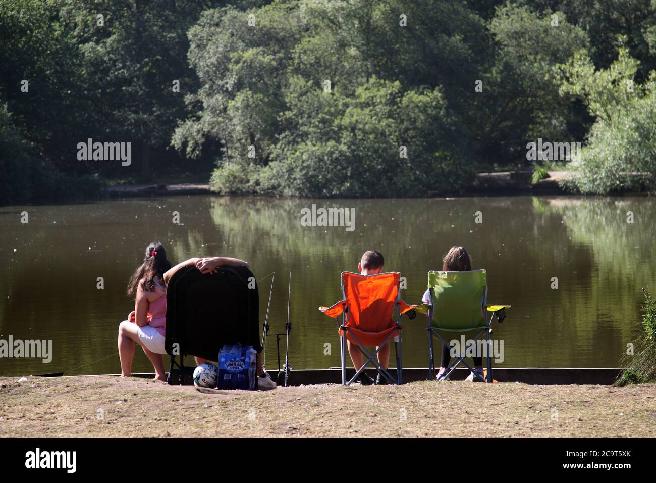A family fishing at Stew Pond after Covid 19 lockdown easing, SSSI ...