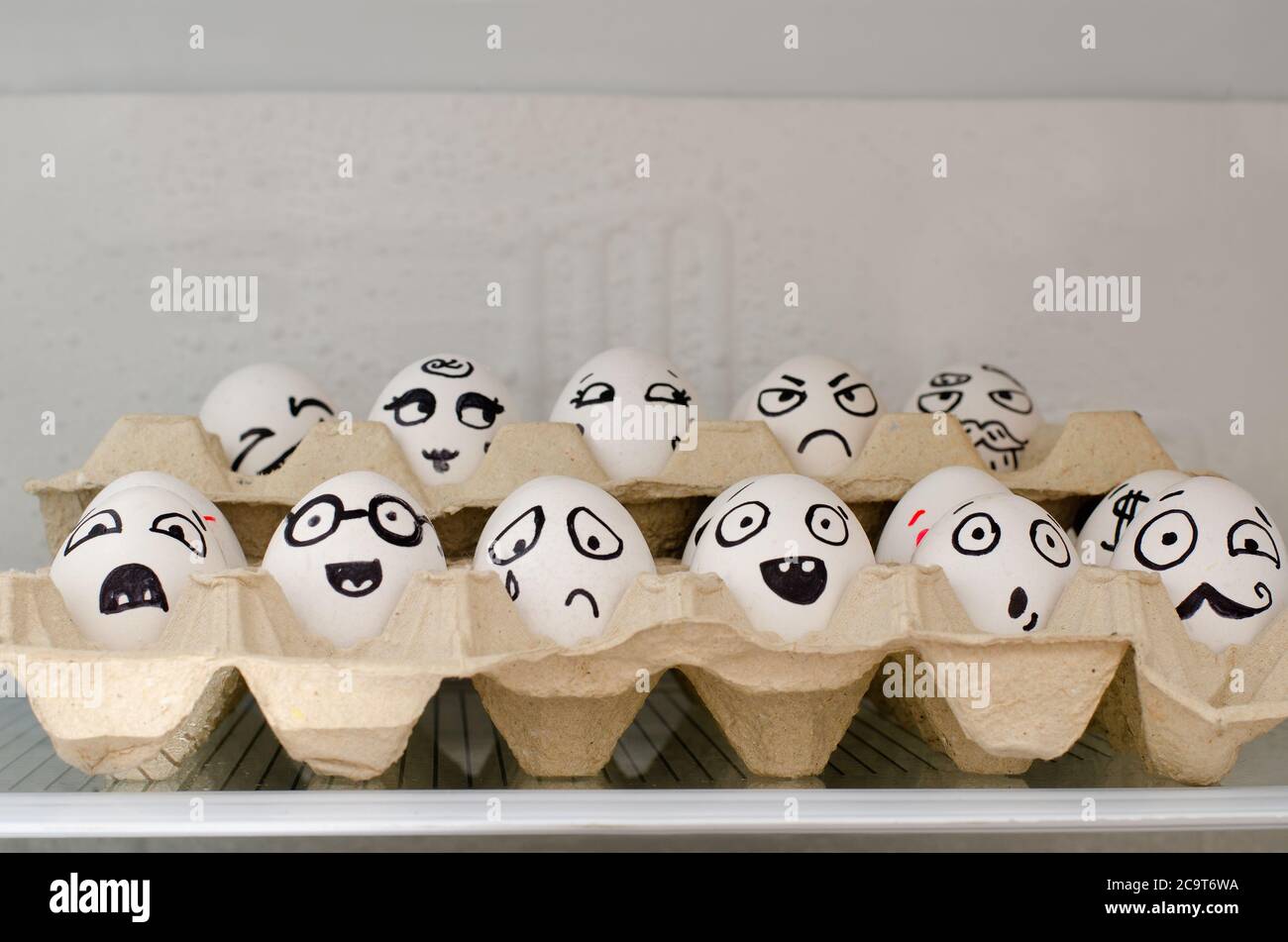 Trays with eggs in the refrigerator, painted emotions close-up Stock ...