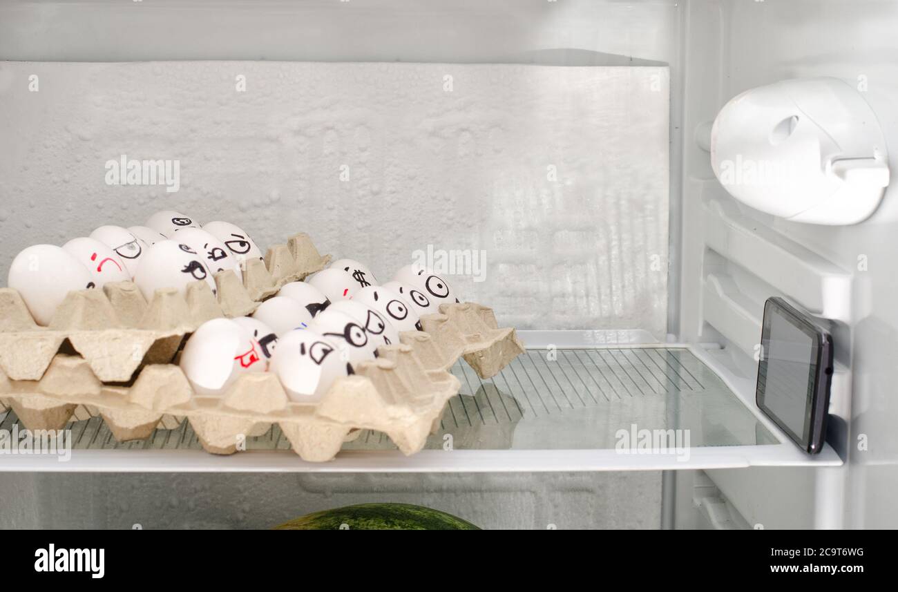 Eggs in trays on a shelf of the refrigerator, located as in a movie ...
