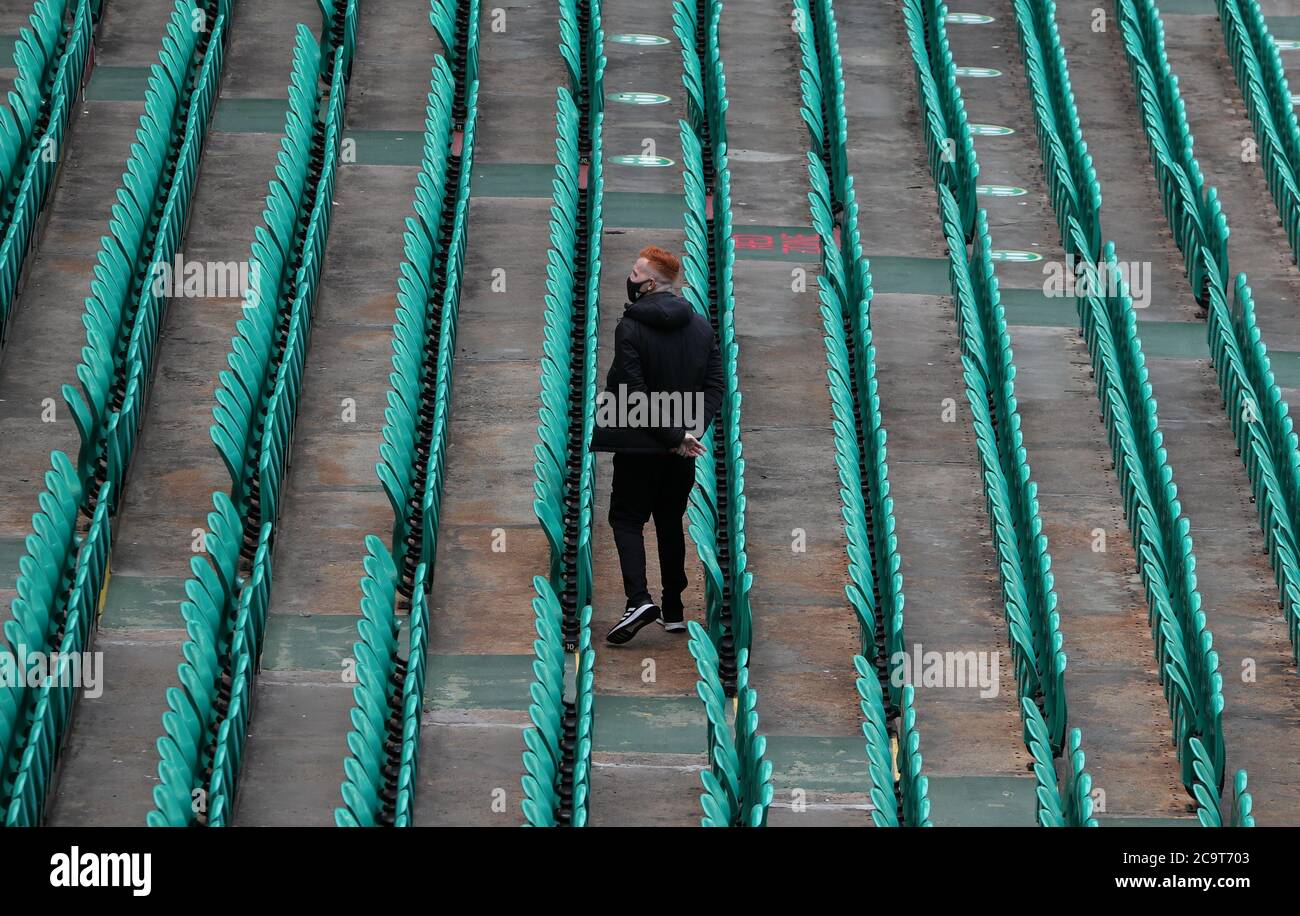 Hamilton Academicalâ€™s media officer Marcus Nash walking along empty ...