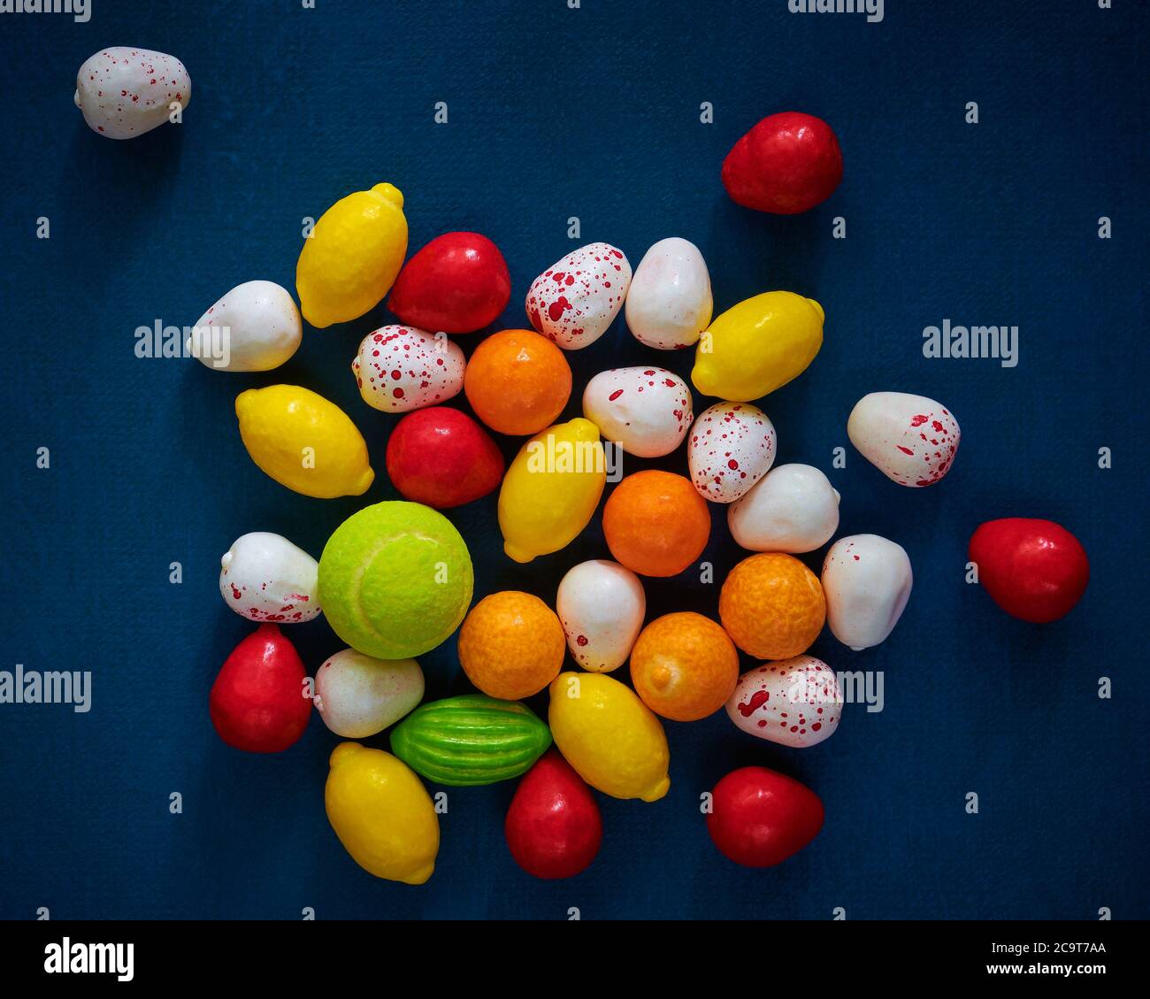 Colored chewing gum scattered on blue background Stock Photo - Alamy