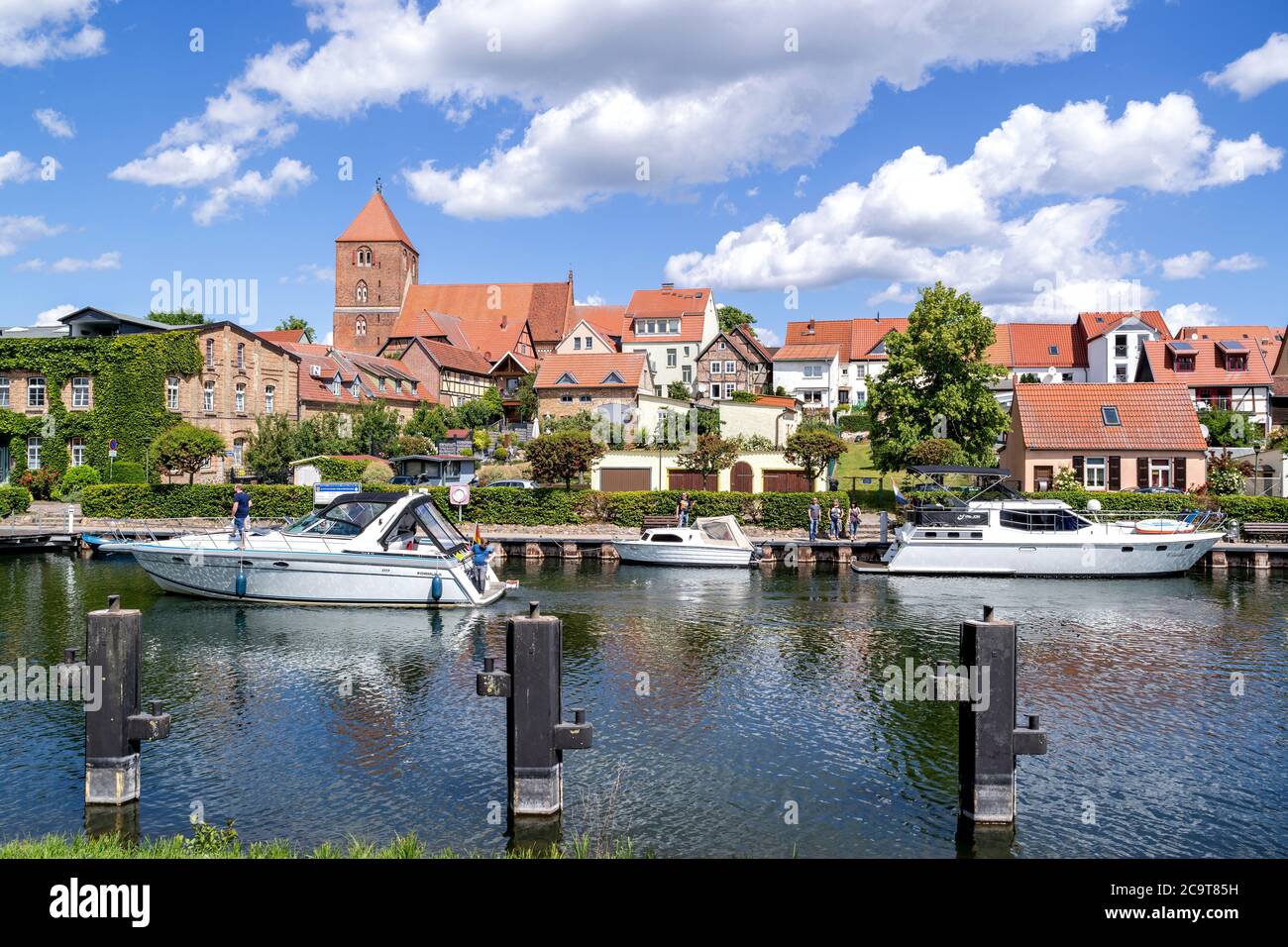 city view of Plau am See, Germany with river Elde and parish church of ...