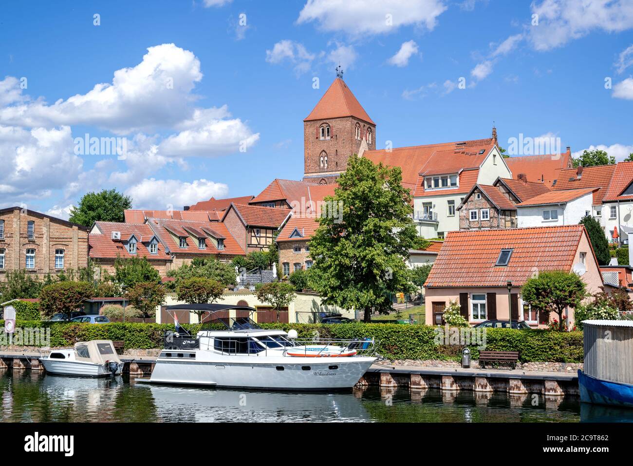 city view of Plau am See, Germany with river Elde and parish church of ...