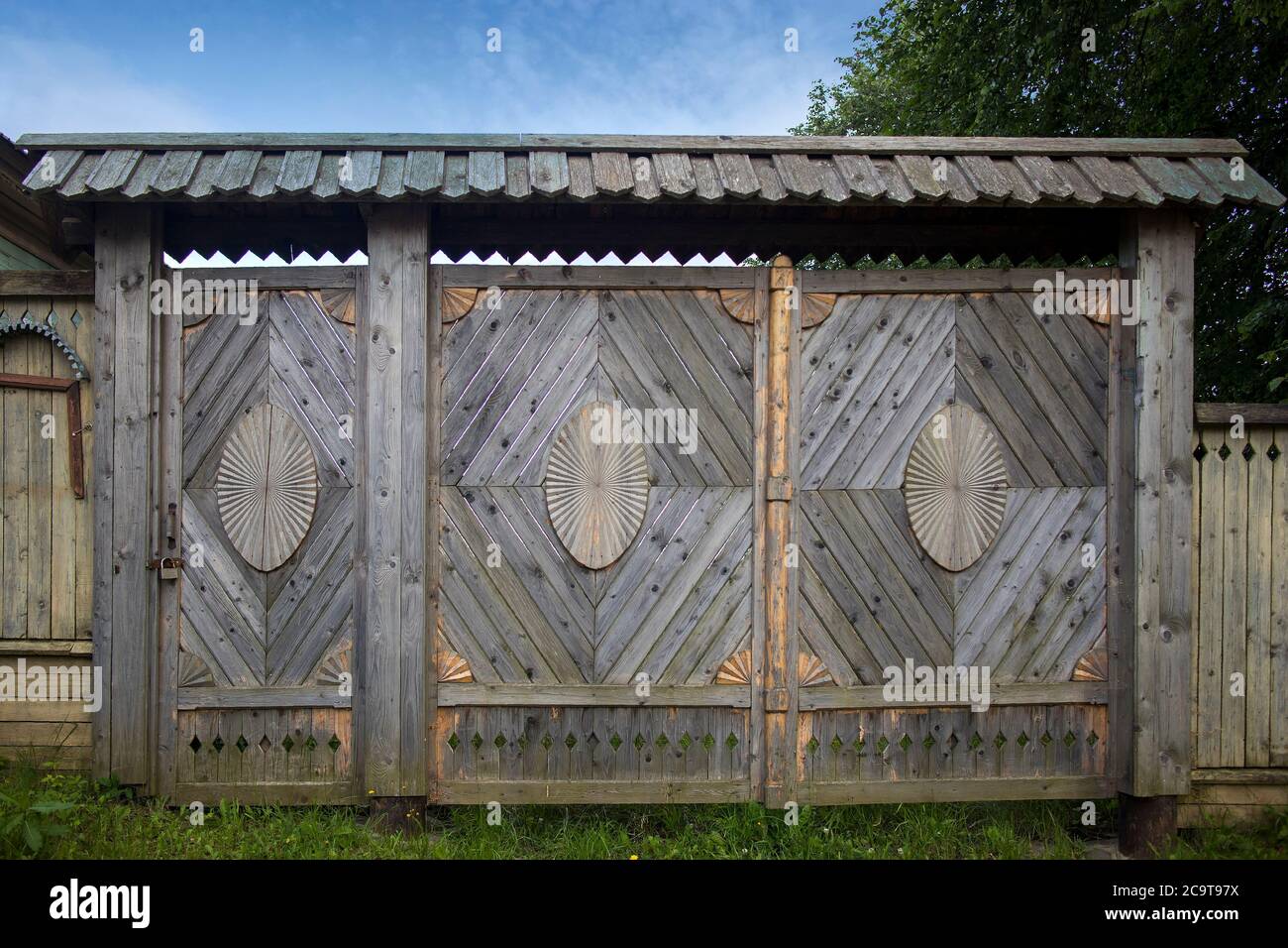 Carved gates on the city wooden manor in traditional style Stock Photo ...