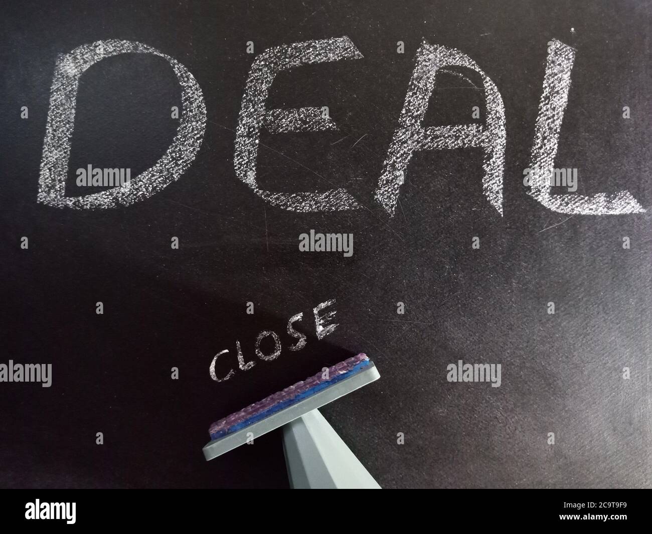 Deal close word presented on chalkboard concept for business ...