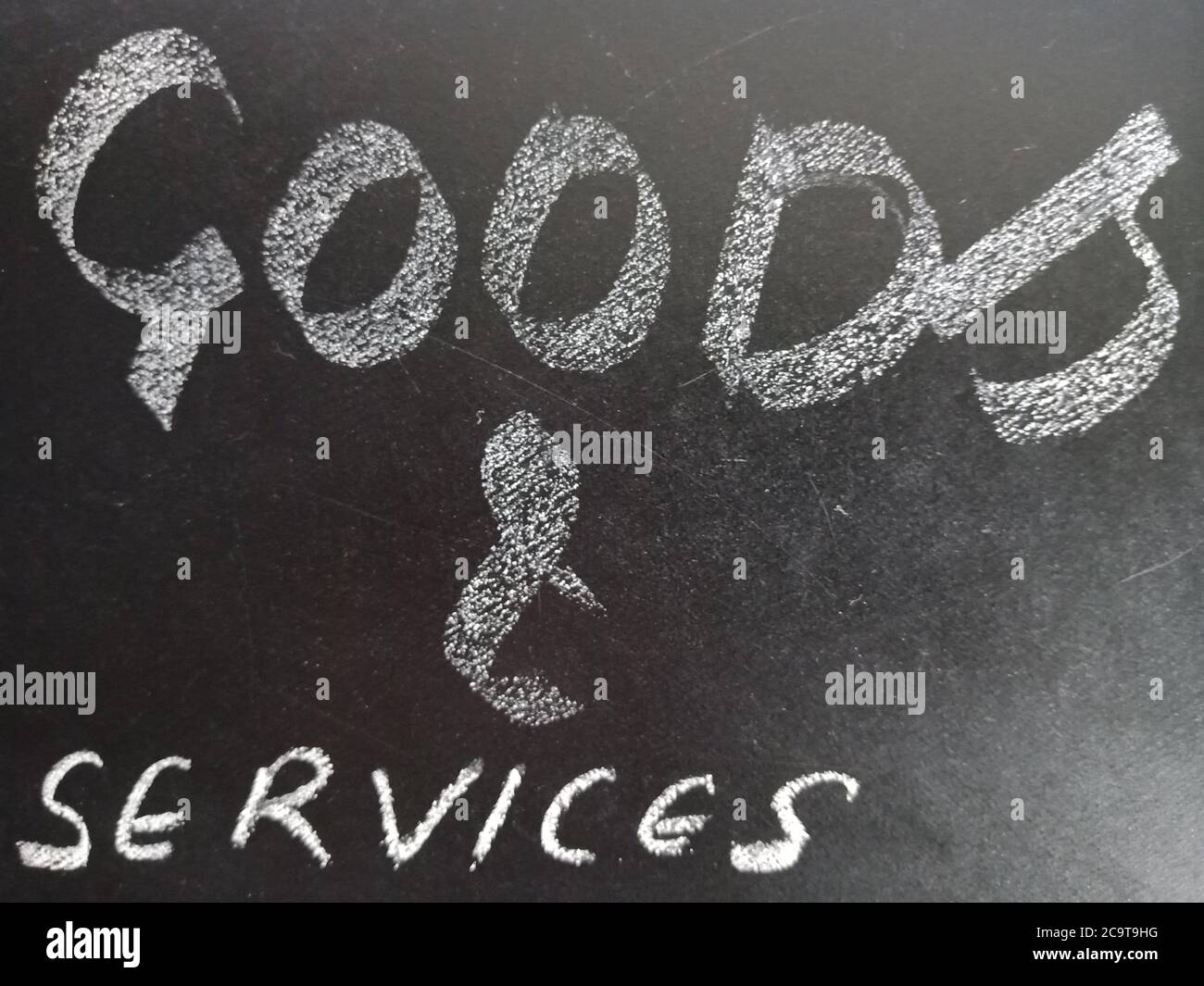 Goods and services word presented on chalkboard concept for business ...