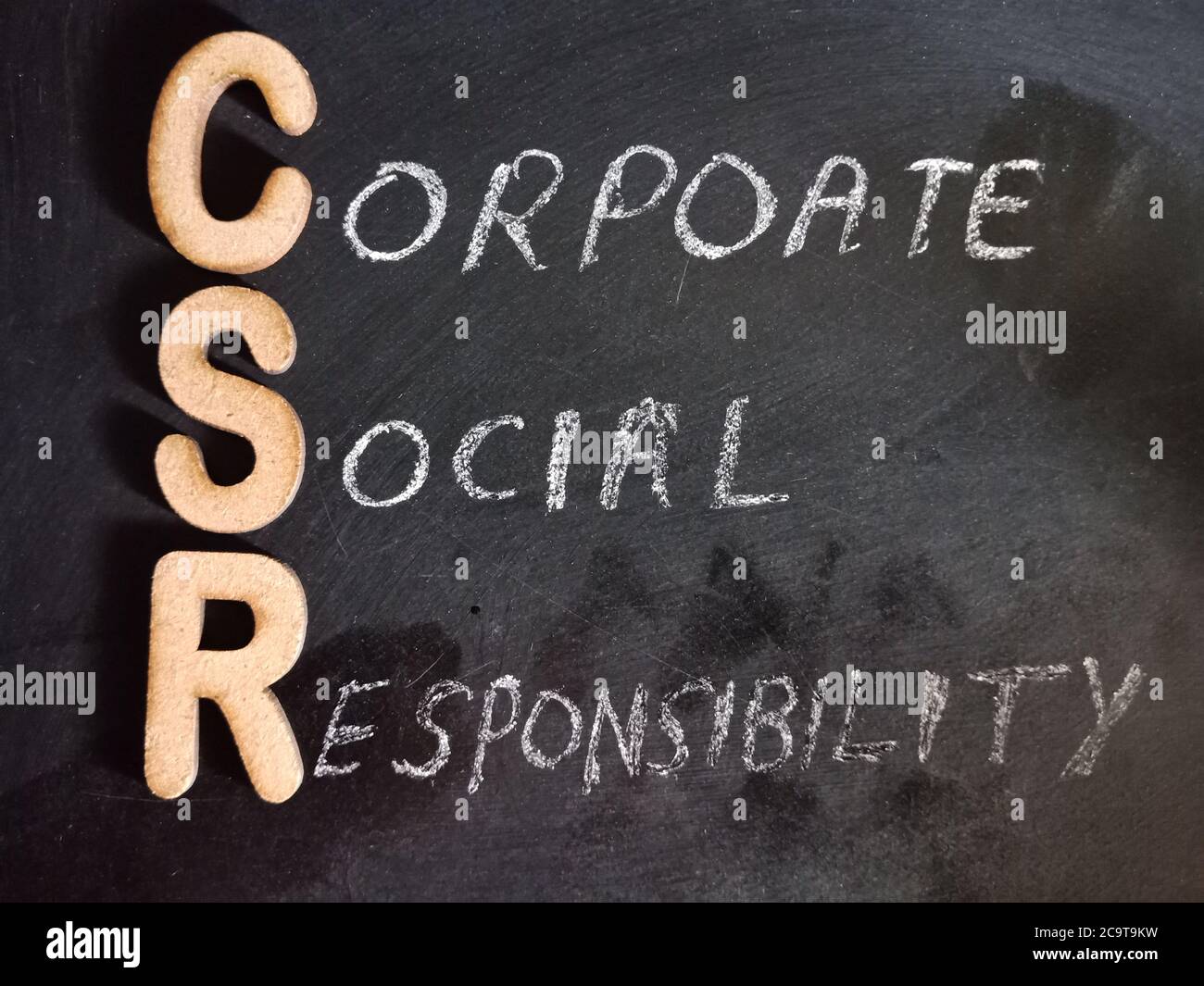 CSR corporate social responsibility word presented on chalkboard ...
