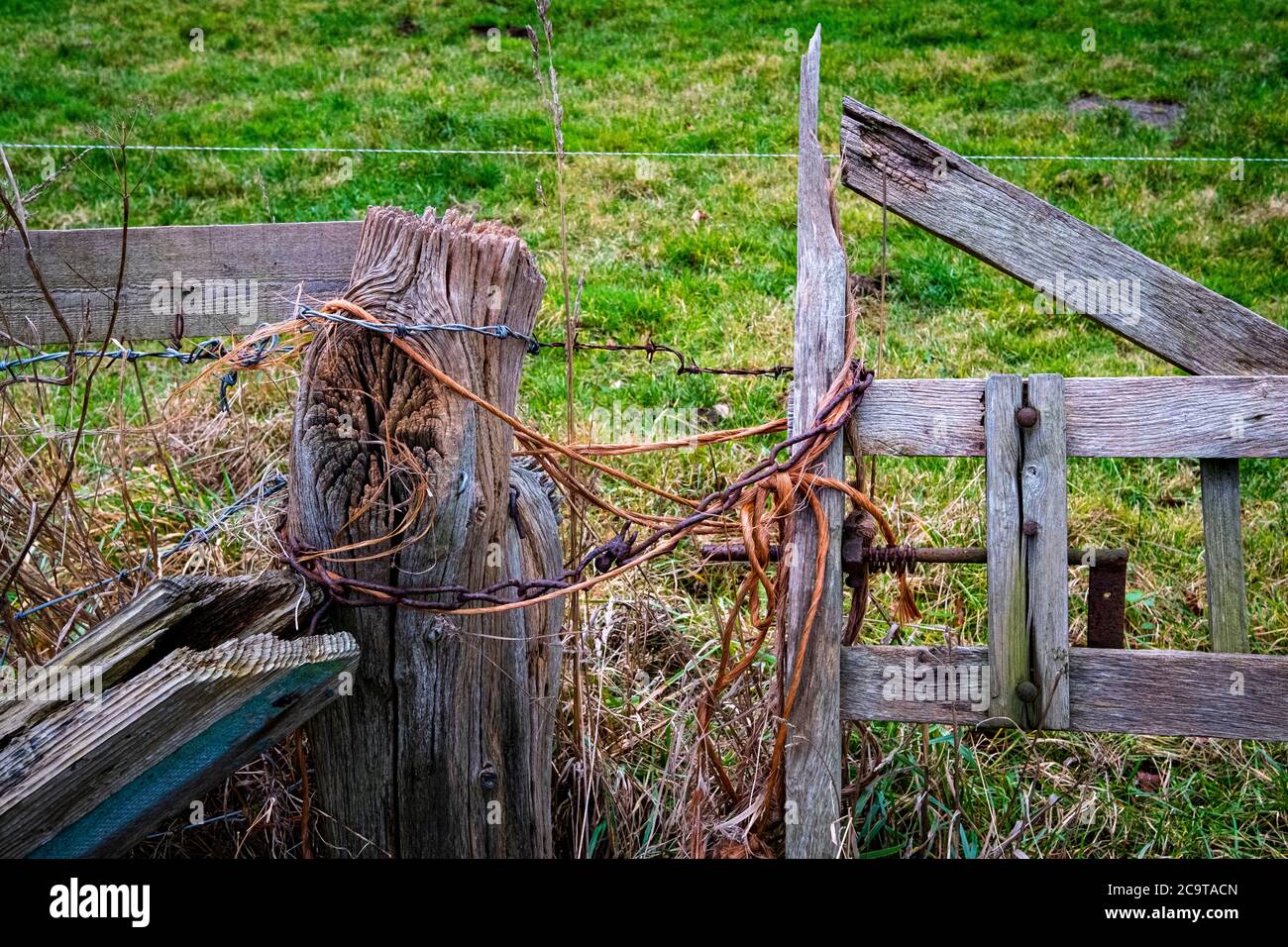 Old wooden gate locket with orange twine and chain Stock Photo - Alamy