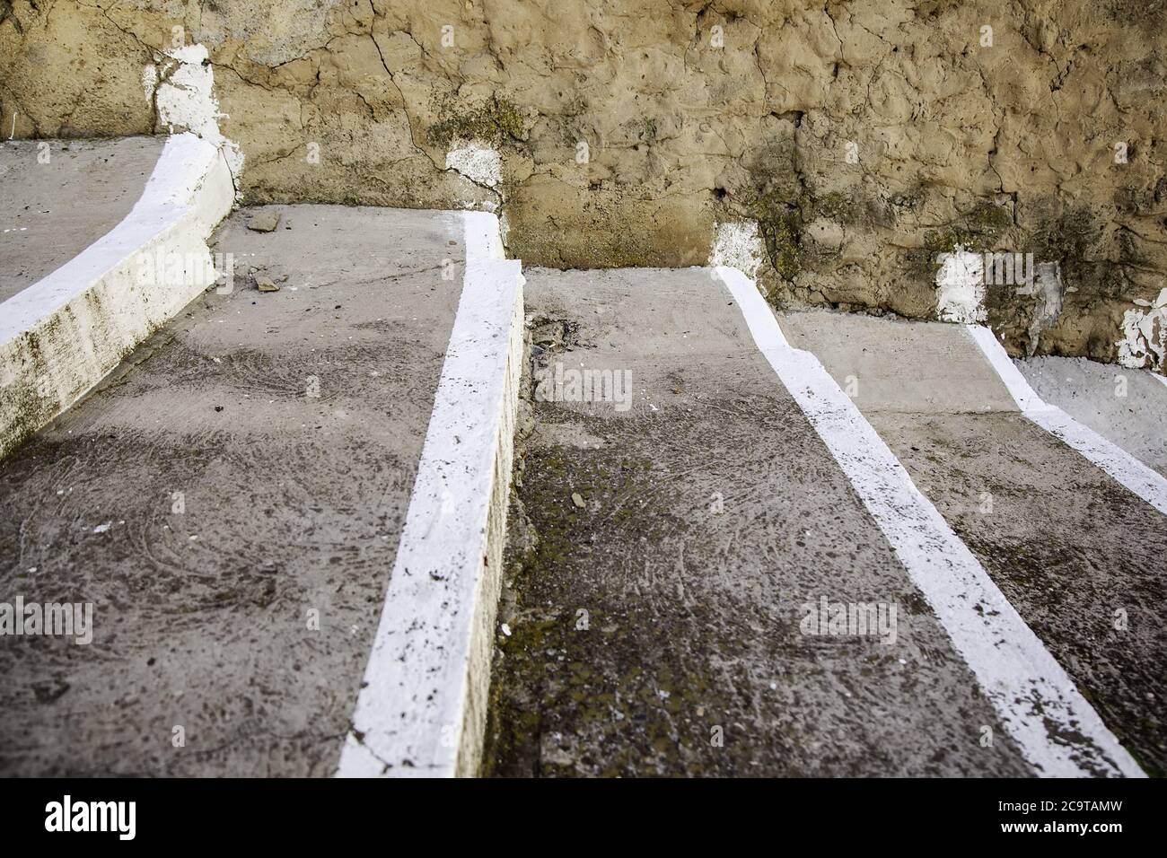 Ancient stone stairs in a village, detail of access for pedestrians ...