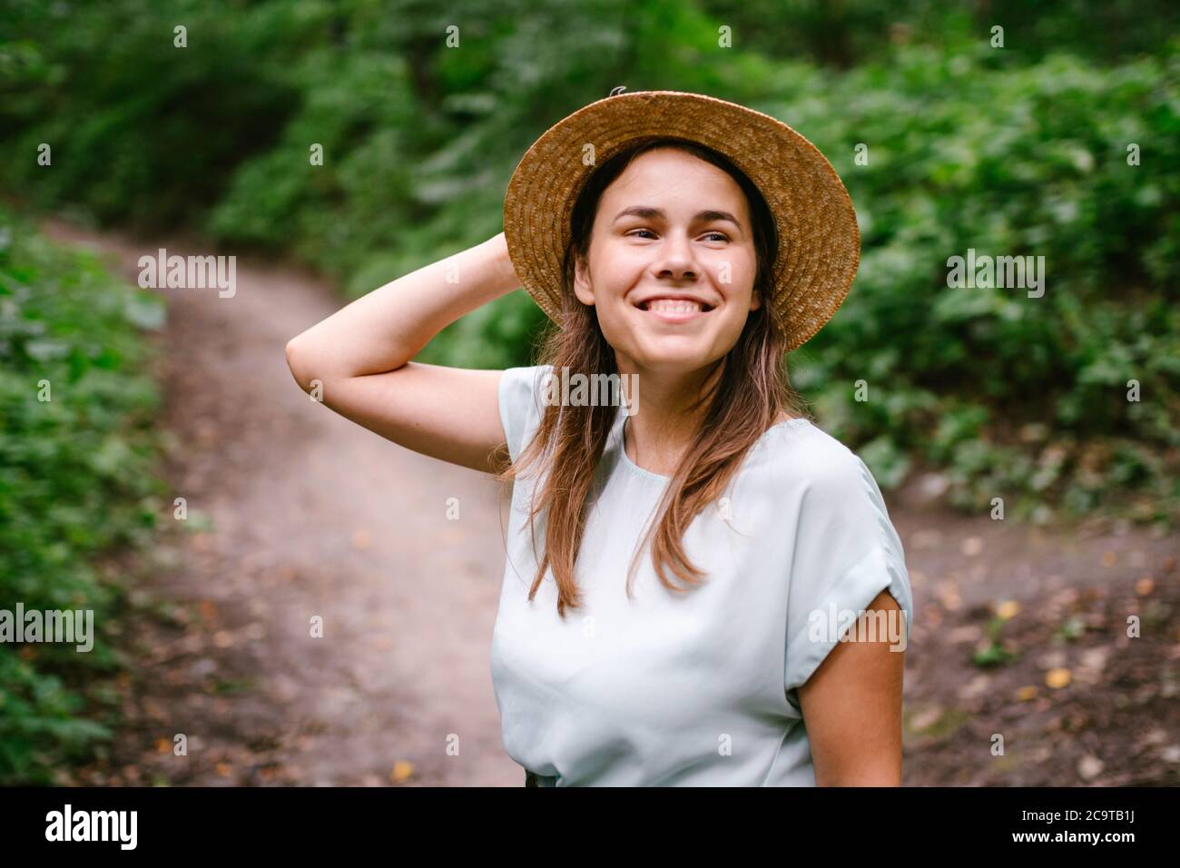 Outdoor photo of exciting girl chilling in a beautiful forest. Joyful ...