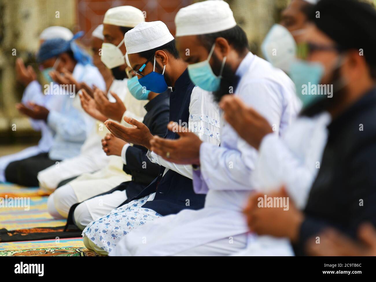 Muslim devotees at a Mosque during prayers. Maintaining social ...
