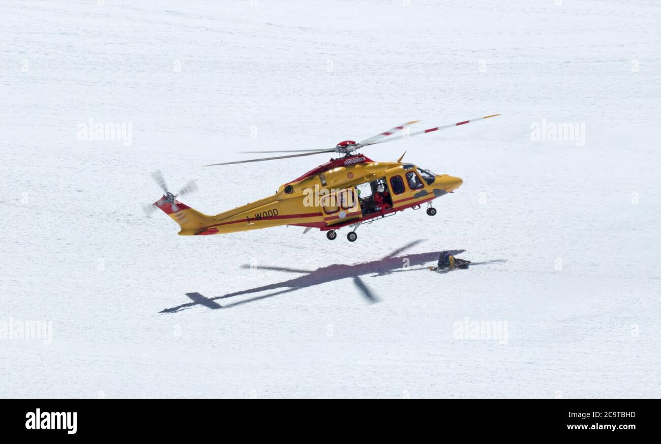 Yellow rescue helicopter near the Swiss Matterhorn Stock Photo - Alamy