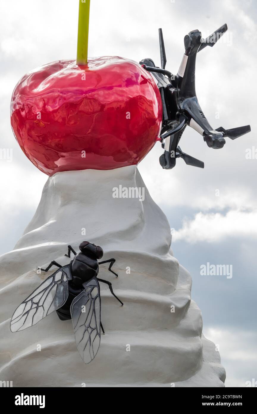 THE END - a giant swirl of whipped cream, a cherry, a fly and a drone ...