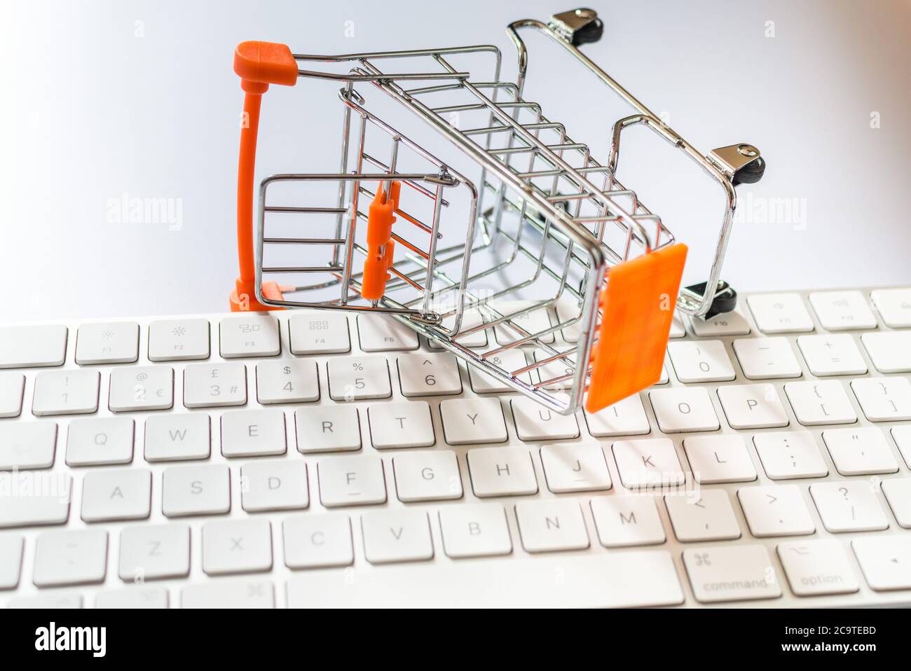 Shopping downturn illustration with a mini shopping trolley or shopping ...