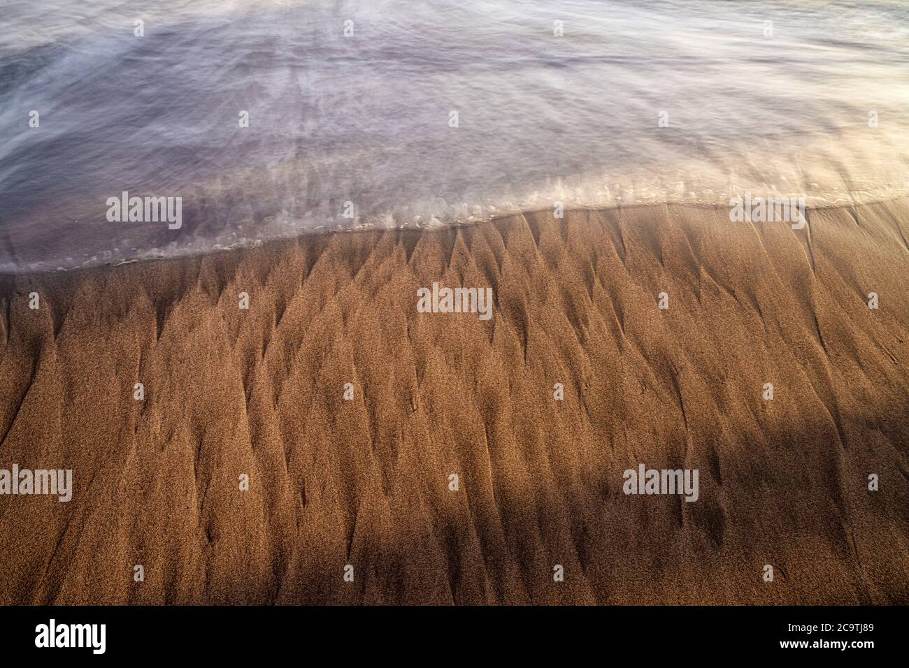Sand patterns at Koki Beach, Maui, Hawaii Stock Photo - Alamy