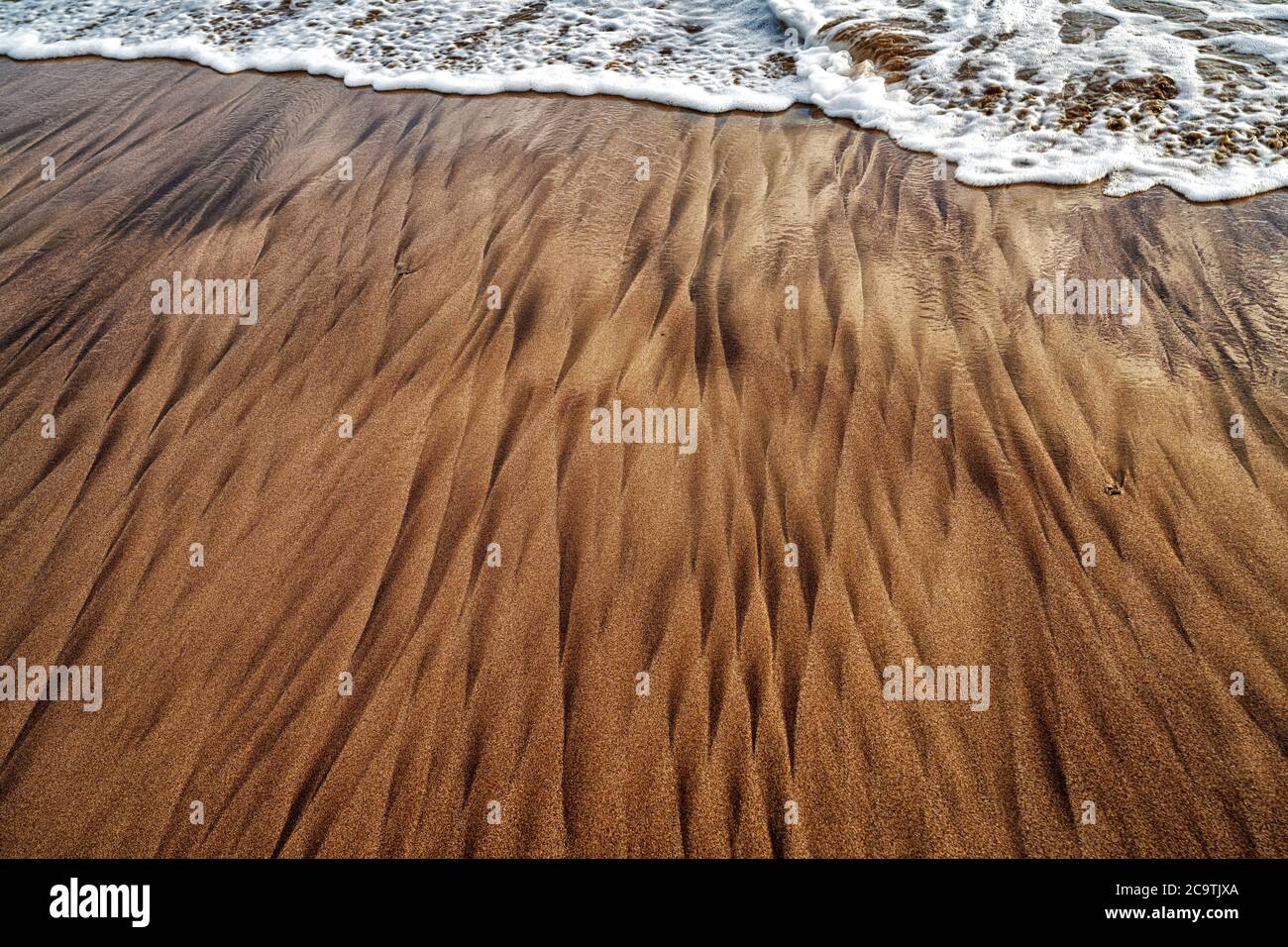 Sand patterns at Koki Beach, Maui, Hawaii Stock Photo - Alamy