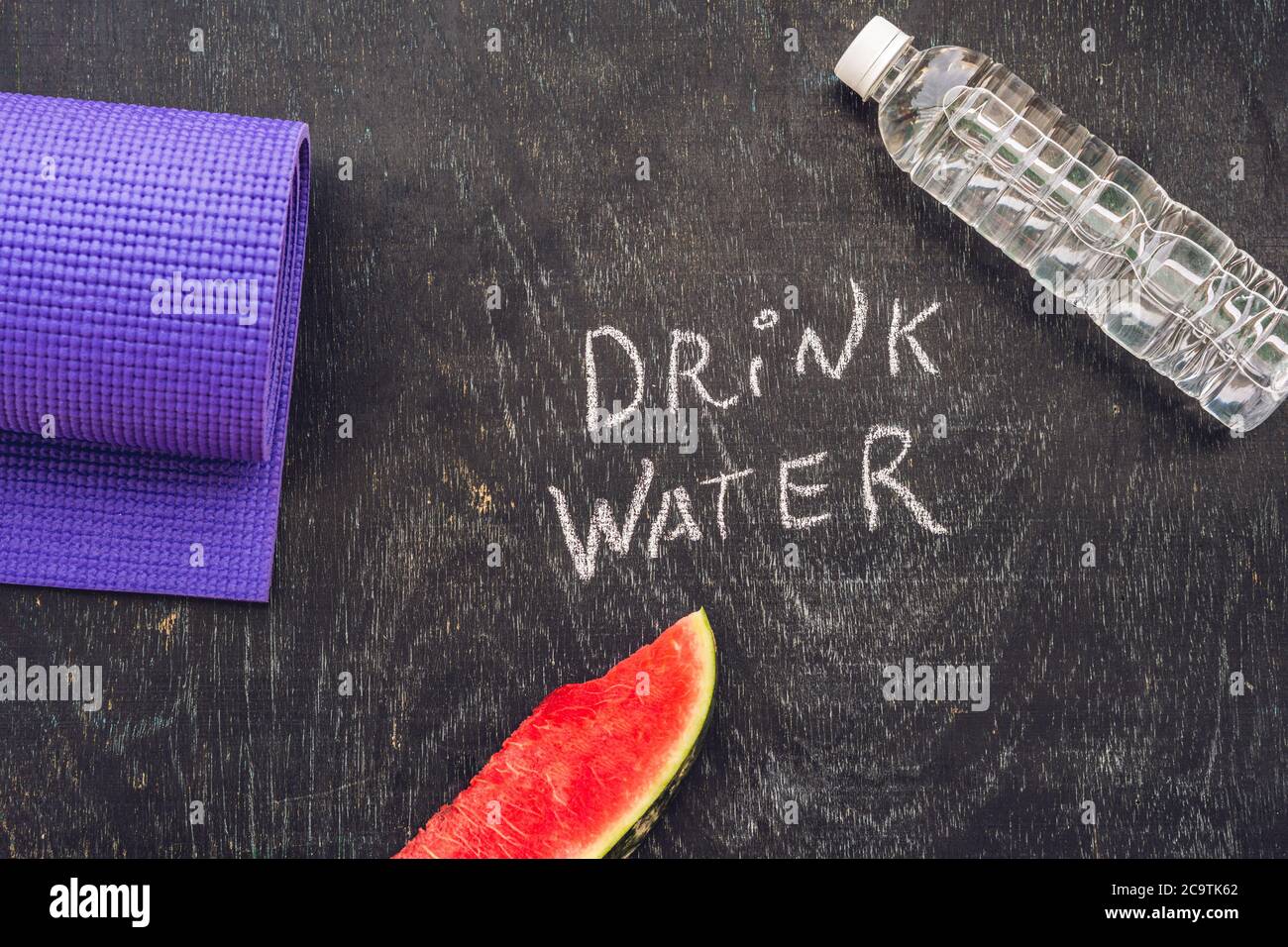 drink more water - hydration reminder - handwriting on On a chalk board ...