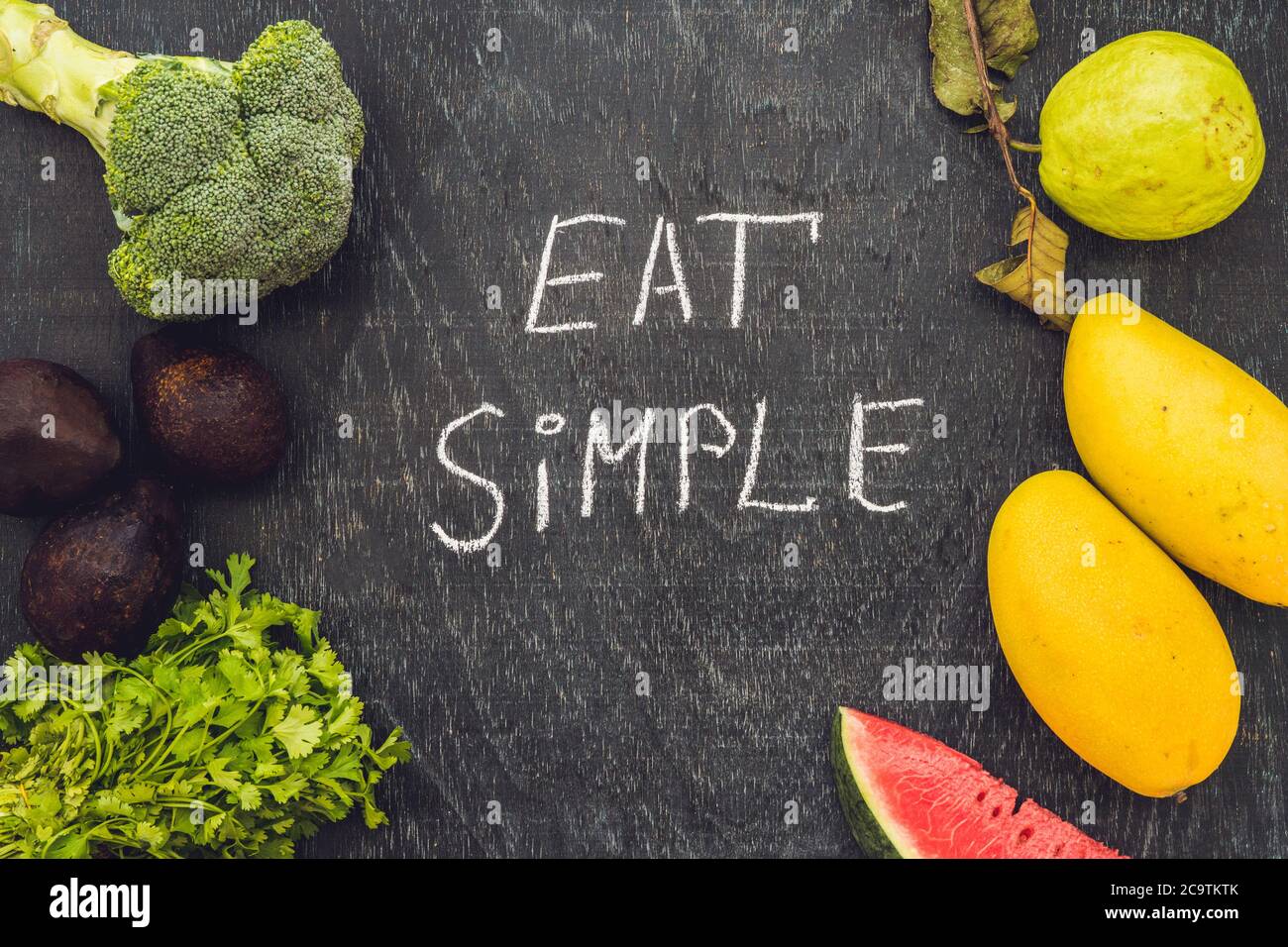 Eat simple is written on chalk board. clean food concept Stock Photo ...