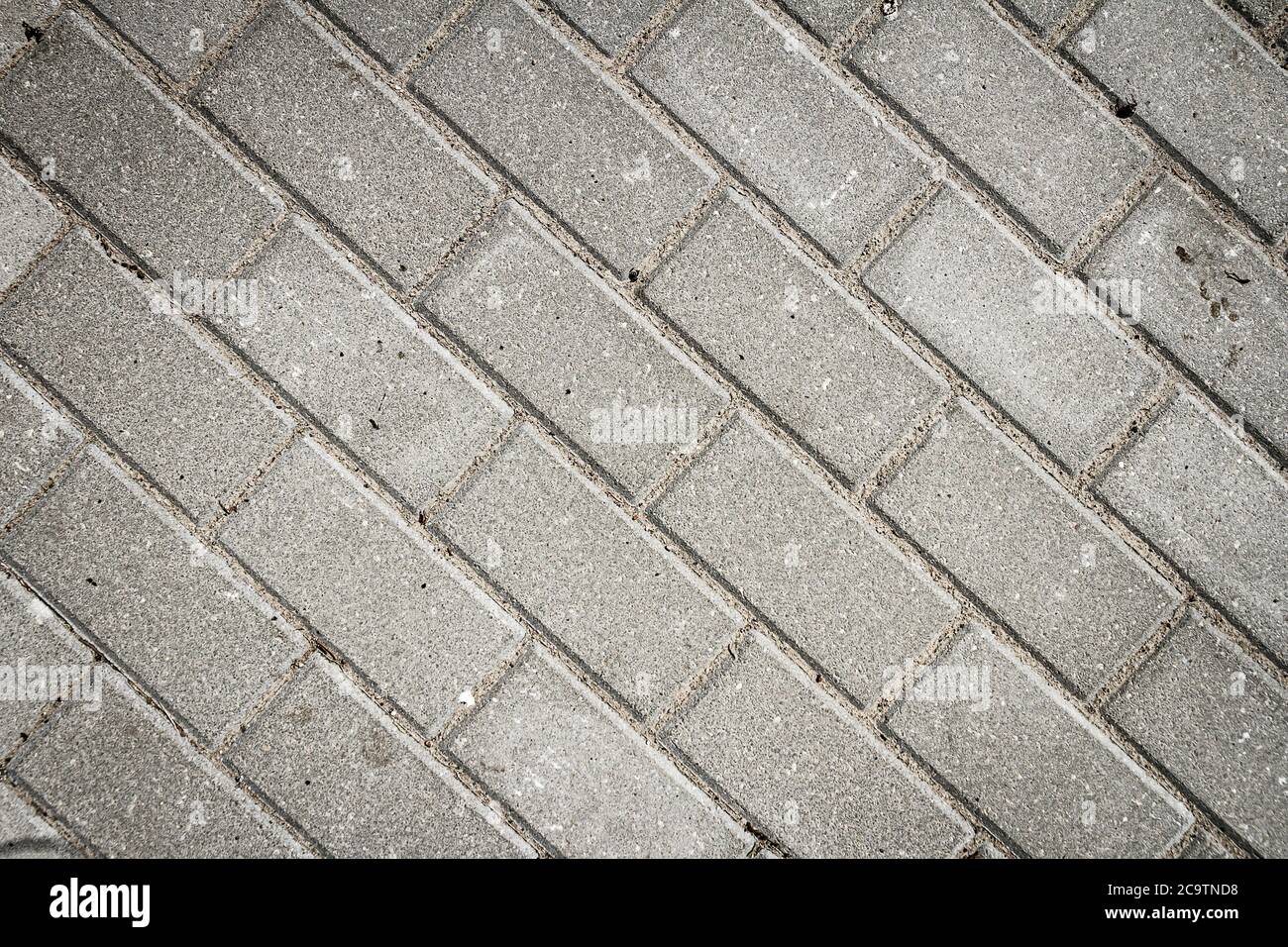 Old concrete tiles in the walkway. Abstract architecture background ...