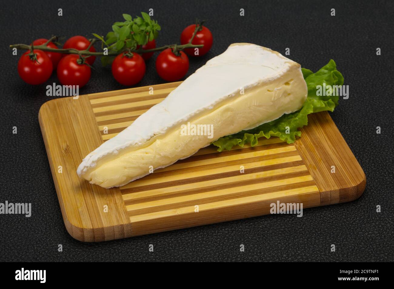 Brie cheese triangle served salad leaves Stock Photo - Alamy