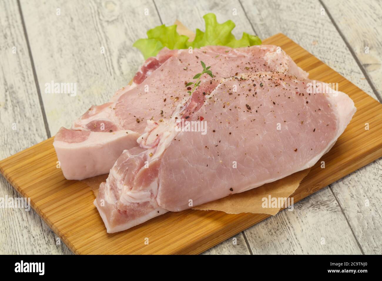 Raw pork meat steak ready for grill Stock Photo - Alamy