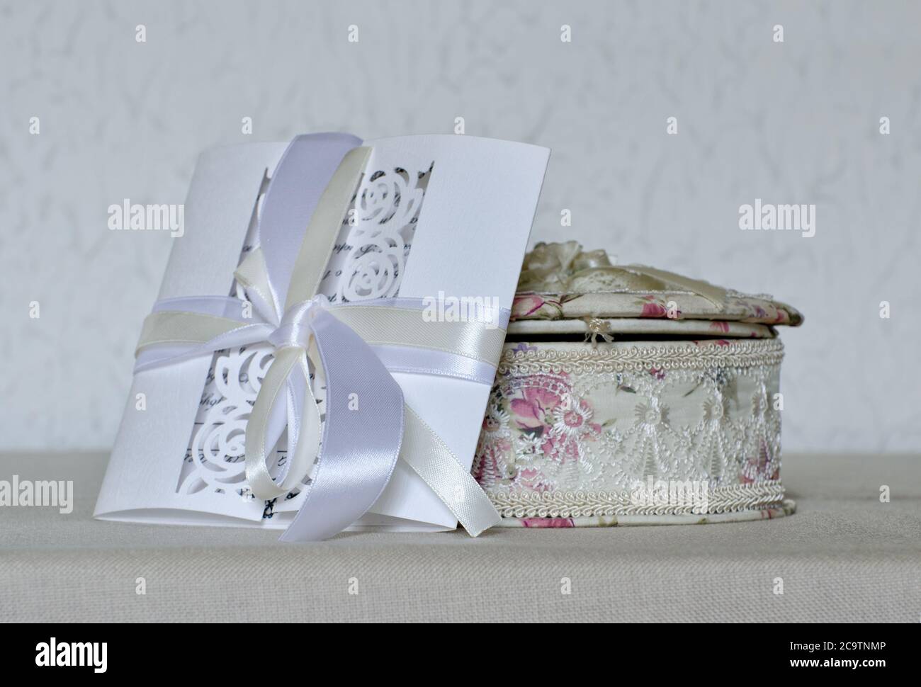 White wedding invitation on the white background, box, space for text ...