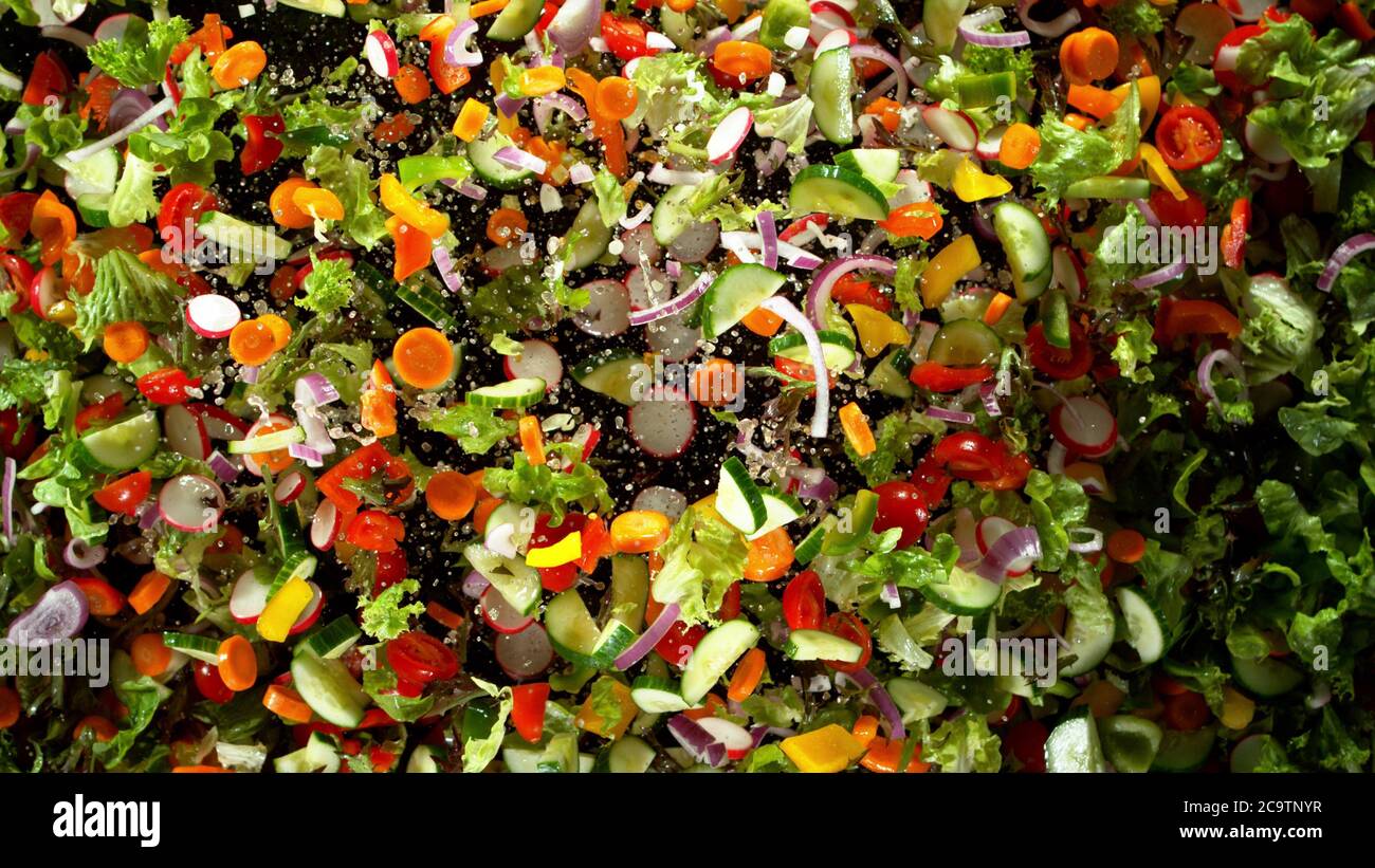 Freeze motion of flying fresh vegetable mix, isolated on black ...