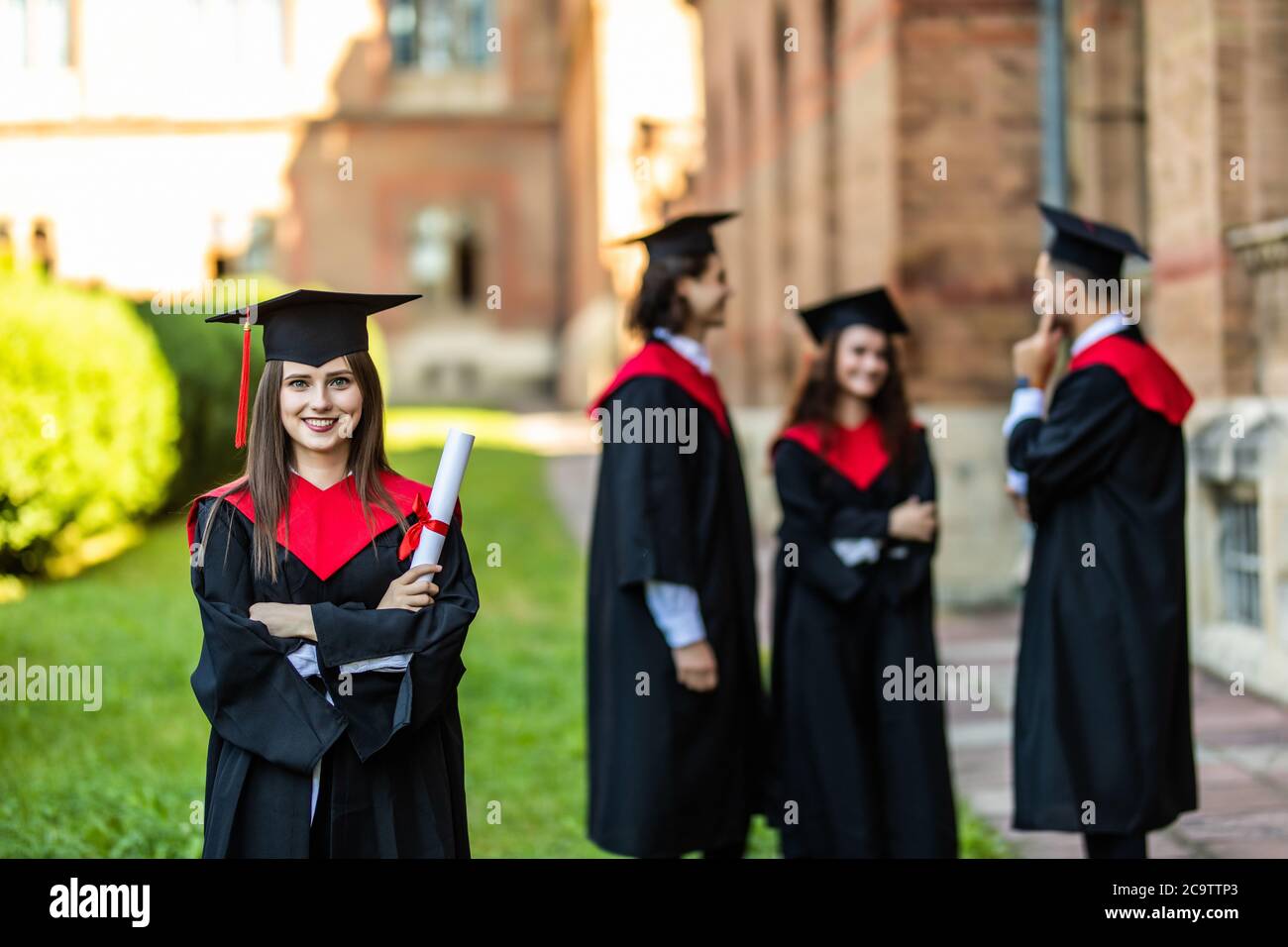 Group of graduate students holding their diploma after graduation Stock ...