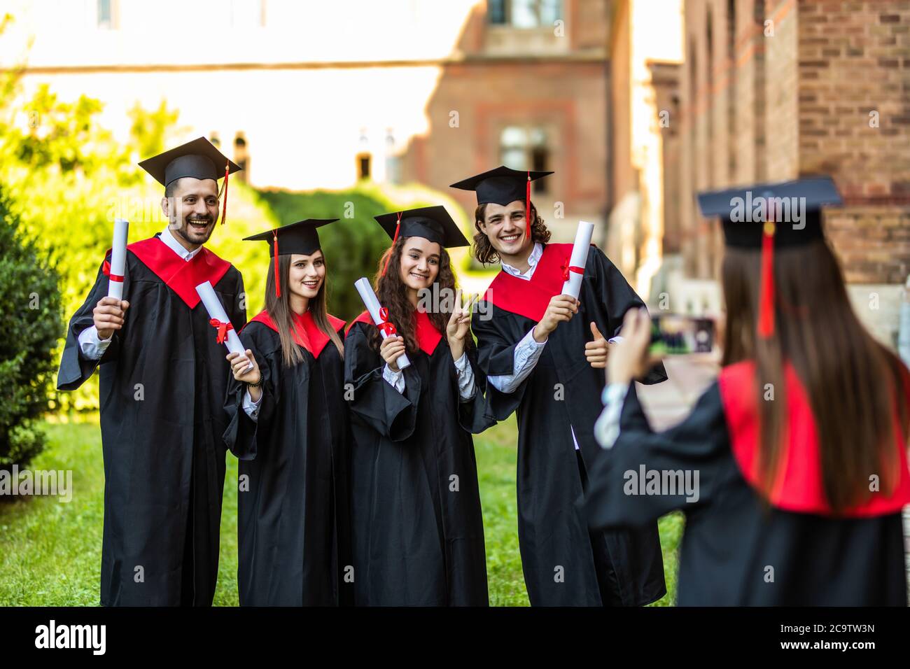 Group of students taking a picture in their graduation Stock Photo - Alamy