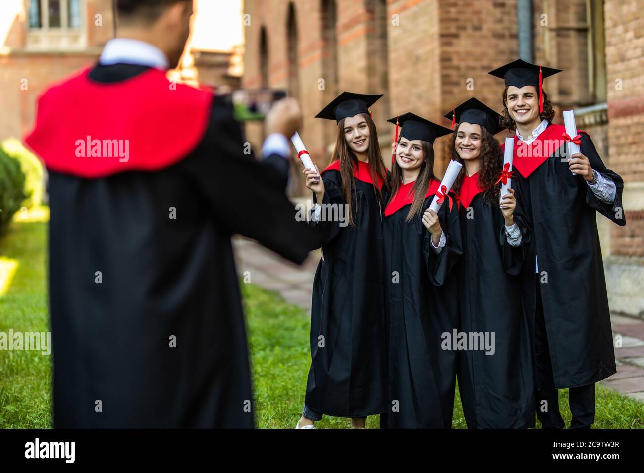 Group of students taking a picture in their graduation Stock Photo - Alamy