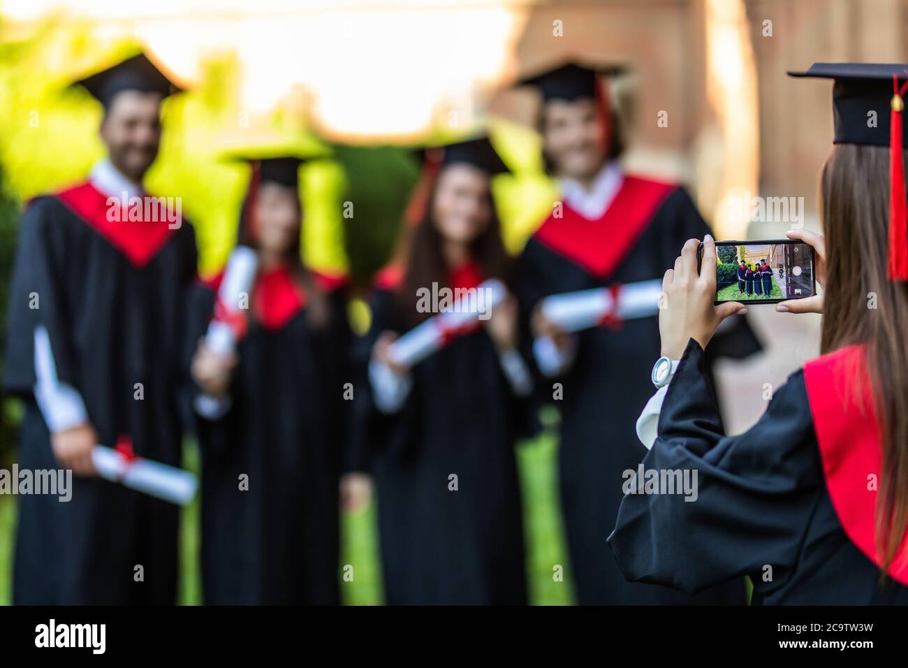 Group of students taking a picture in their graduation Stock Photo - Alamy