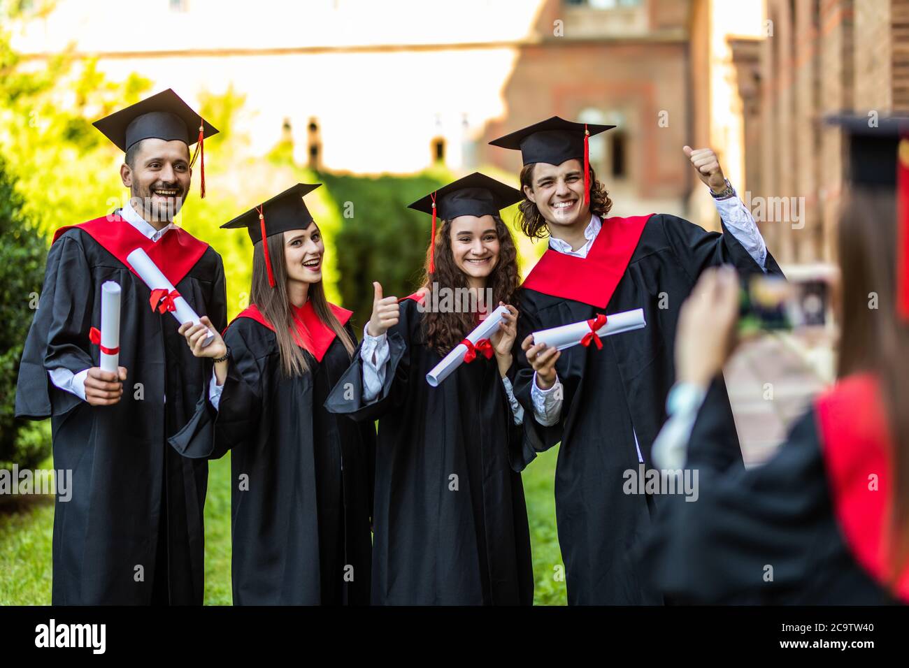 Group of students taking a picture in their graduation Stock Photo - Alamy