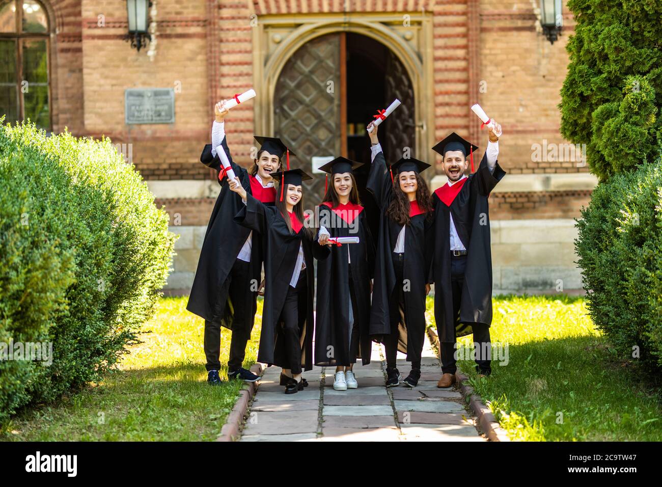 Graduates embrace, enjoy and look forward on the graduation ceremony ...