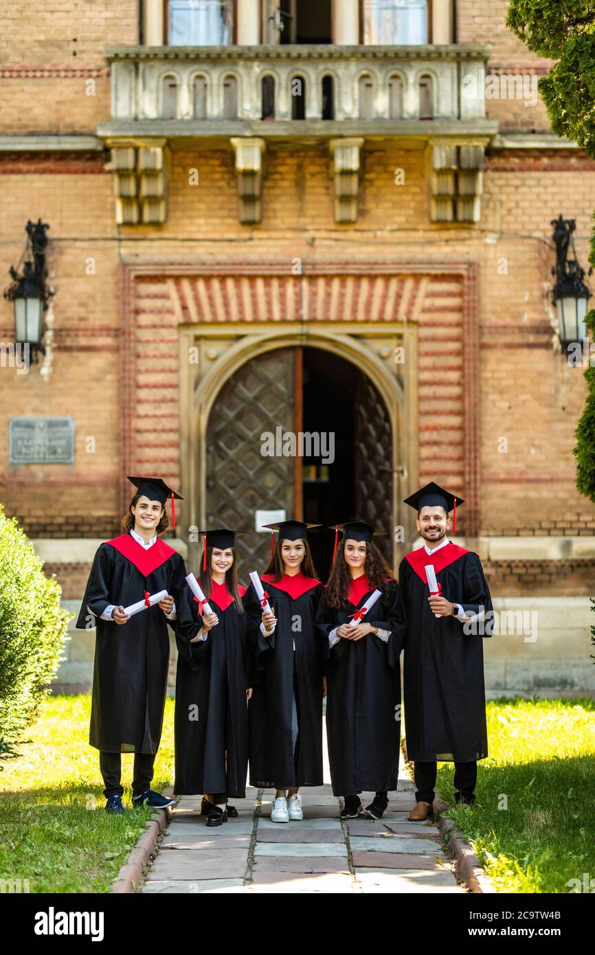 Graduates embrace, enjoy and look forward on the graduation ceremony ...