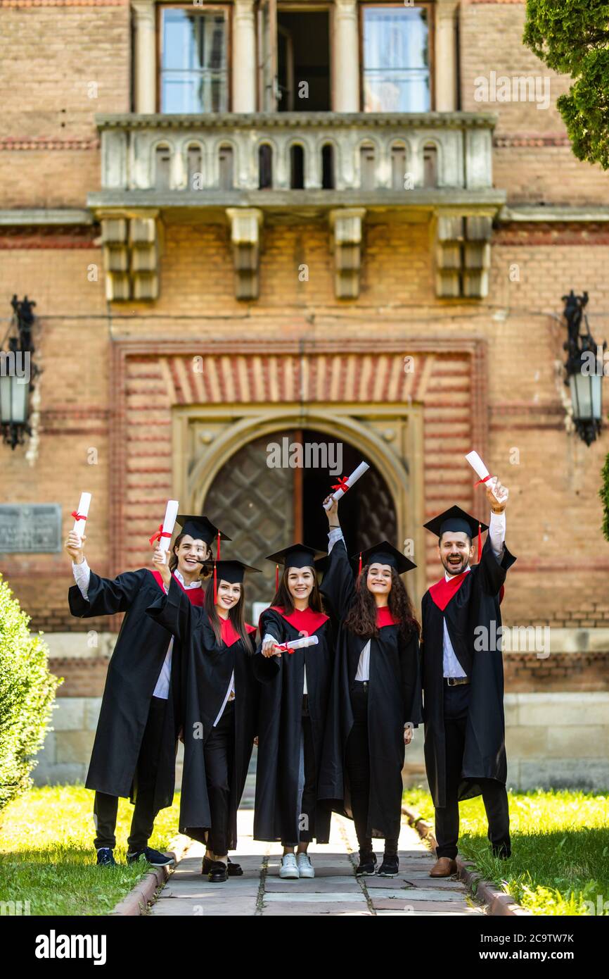 Graduates embrace, enjoy and look forward on the graduation ceremony ...
