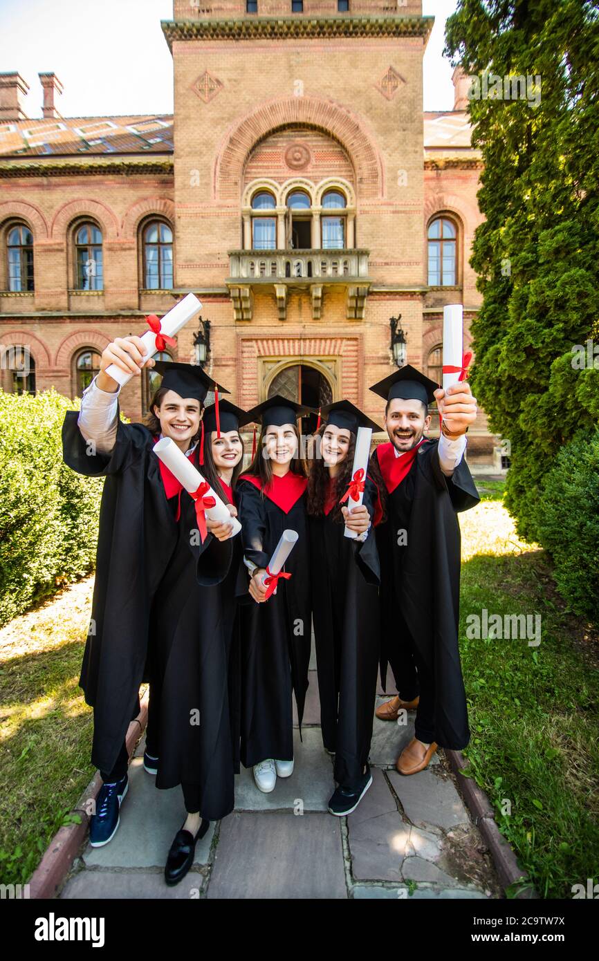 Graduates embrace, enjoy and look forward on the graduation ceremony ...