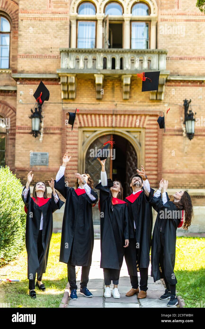 Graduating Students Throwing Caps in the Air Stock Photo - Alamy