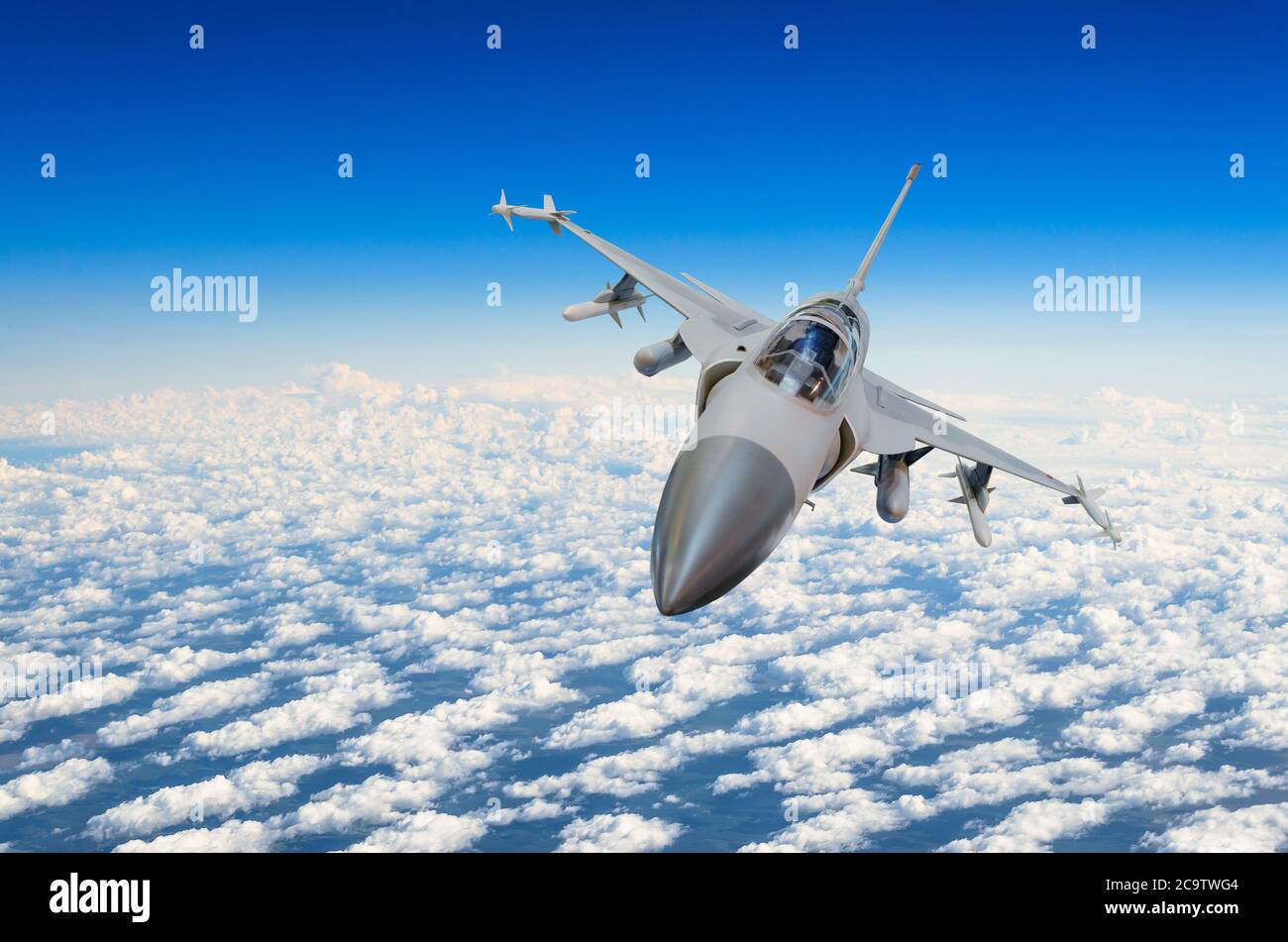 Military fighter jet plane above the clouds Stock Photo - Alamy