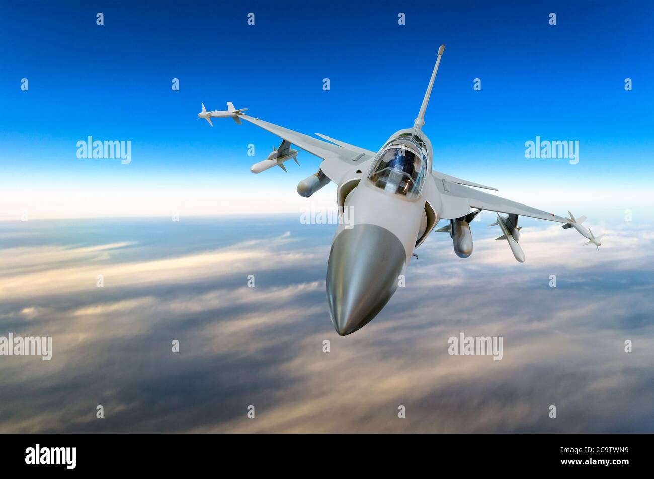 Military fighter jet against a blue sky with a backlight from below ...