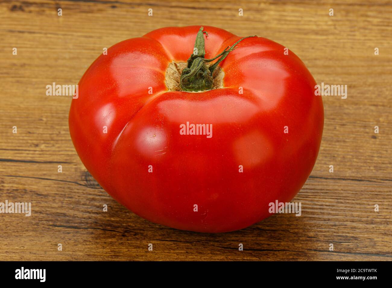 Ripe big juicy red tomato for cooking Stock Photo - Alamy