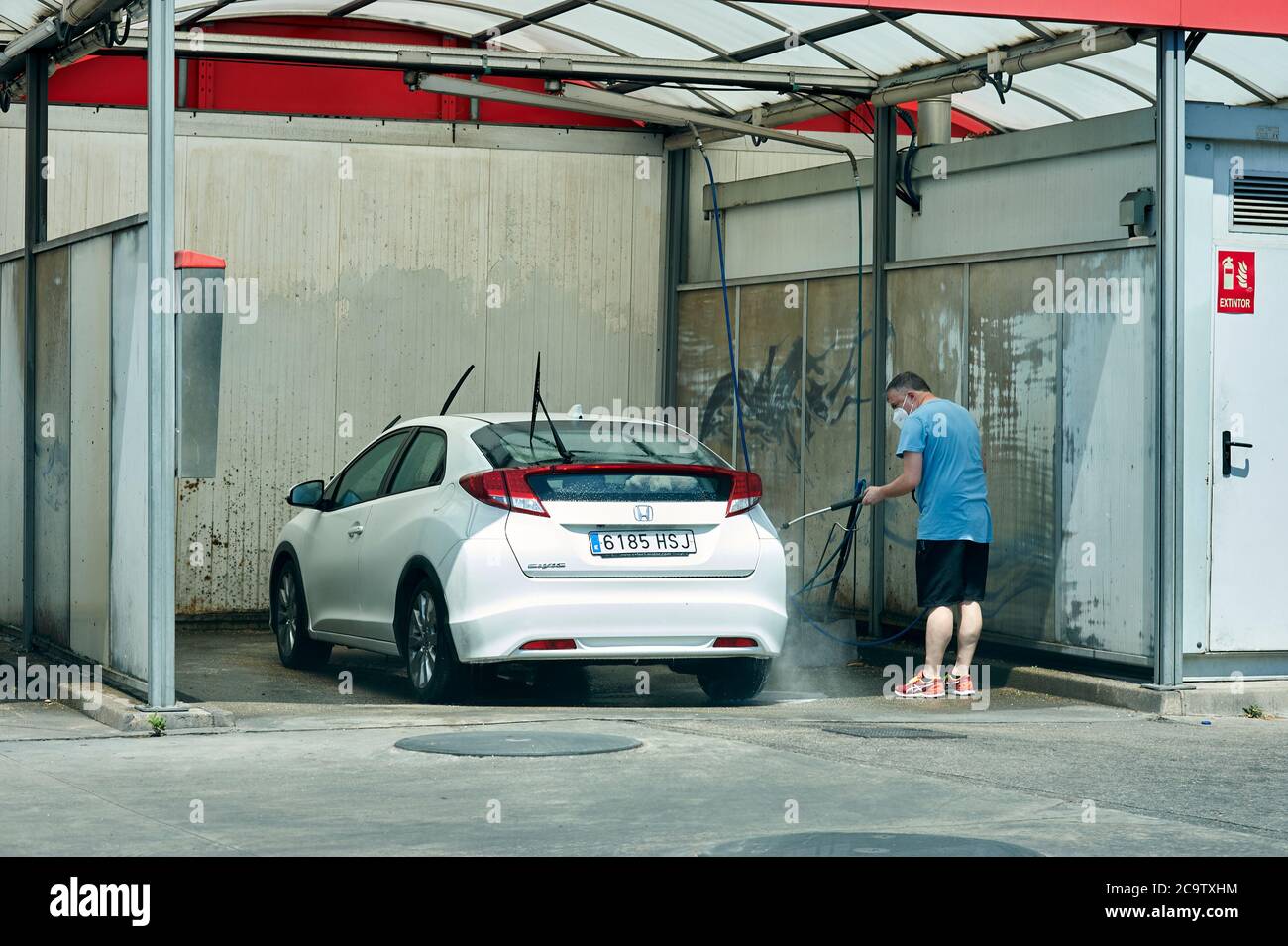 Madrid, Spain - July 18, 2020: People wash their car with pressure ...