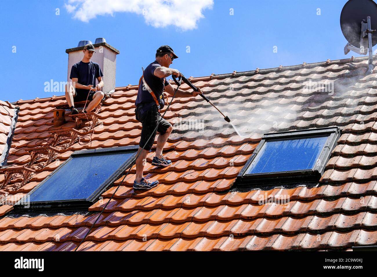 Window cleaner cleaning roof hi-res stock photography and images - Alamy