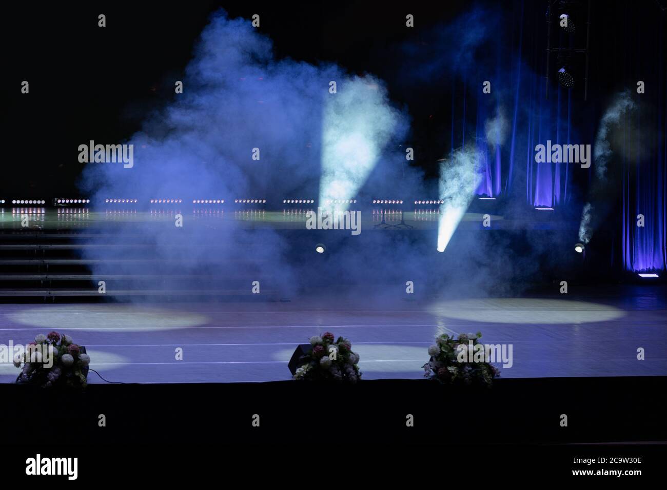 Theater stage with puffs of smoke, illuminated by stage light Stock ...