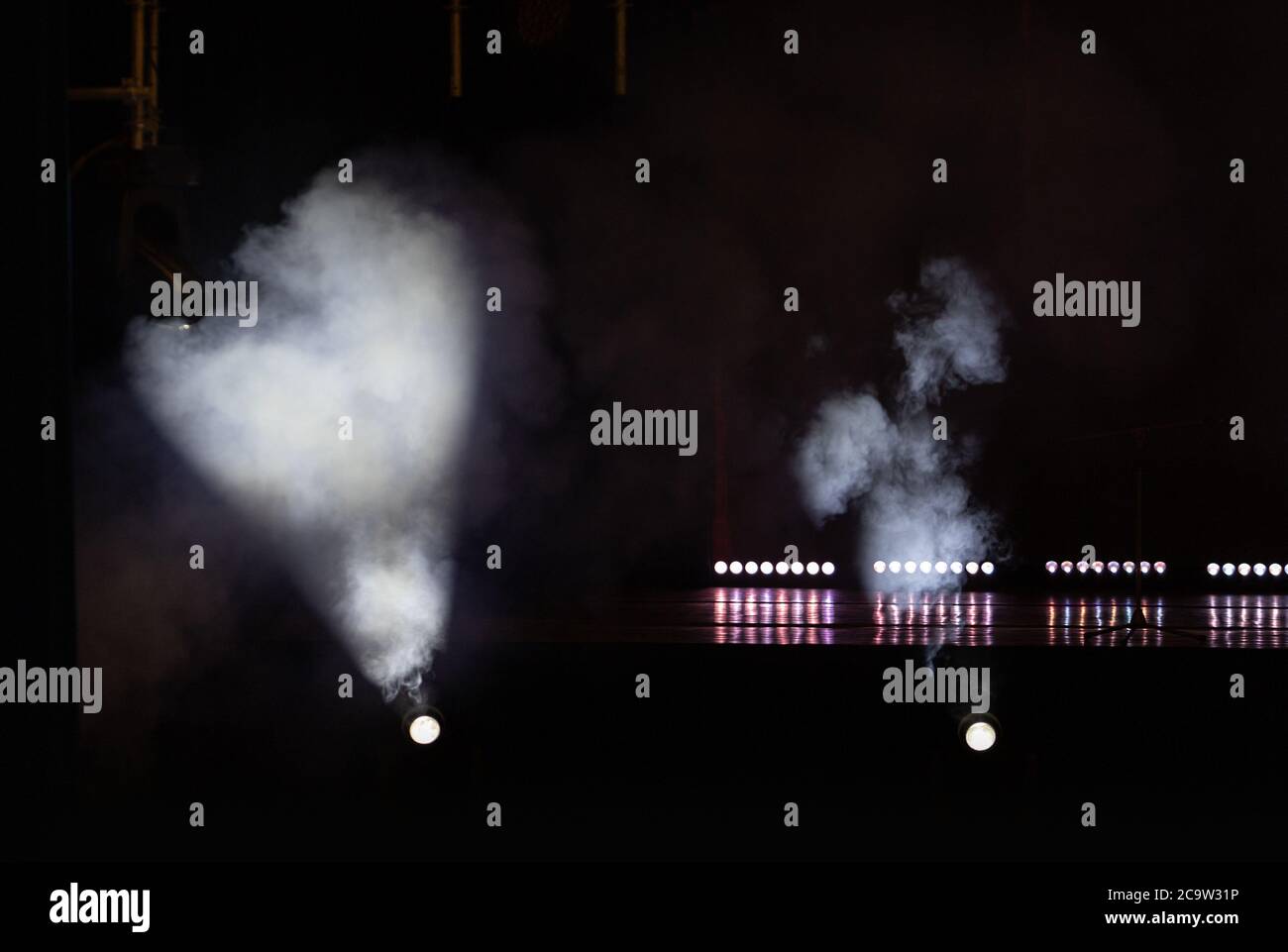 Theater stage with puffs of smoke, illuminated by stage light Stock ...