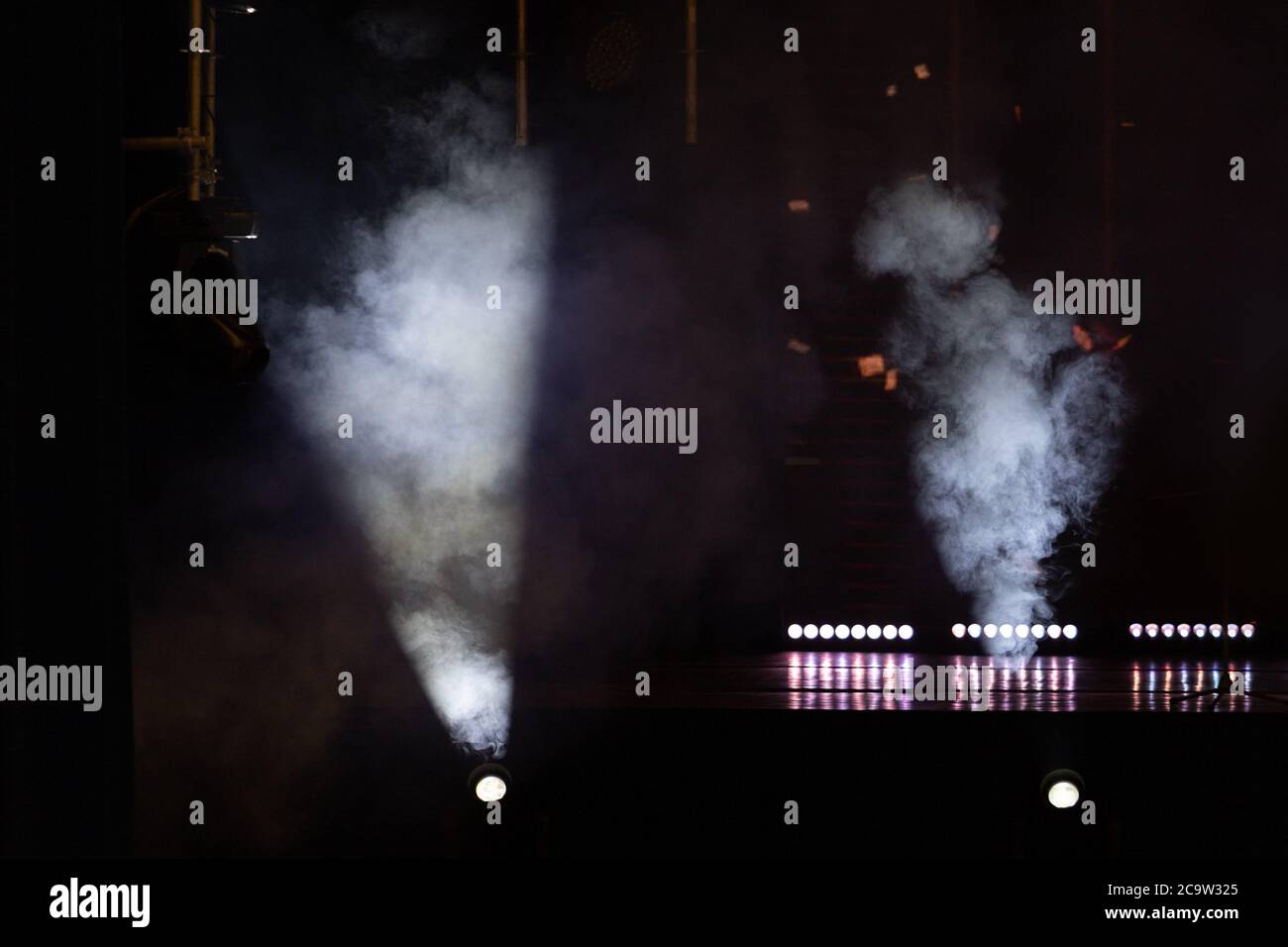 Theater stage with puffs of smoke, illuminated by stage light Stock ...
