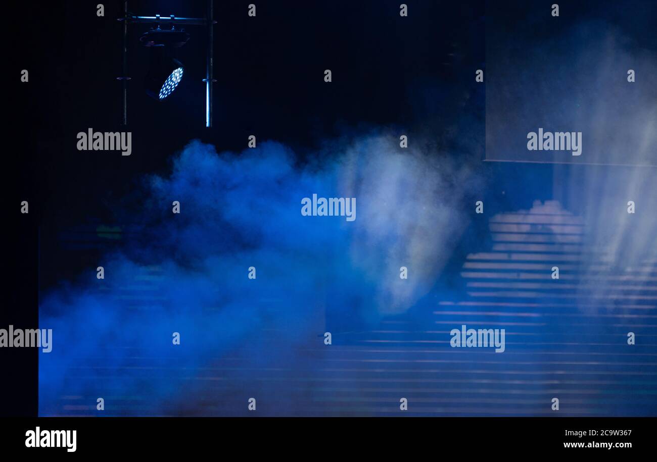 Theater stage with puffs of smoke, illuminated by stage light Stock ...