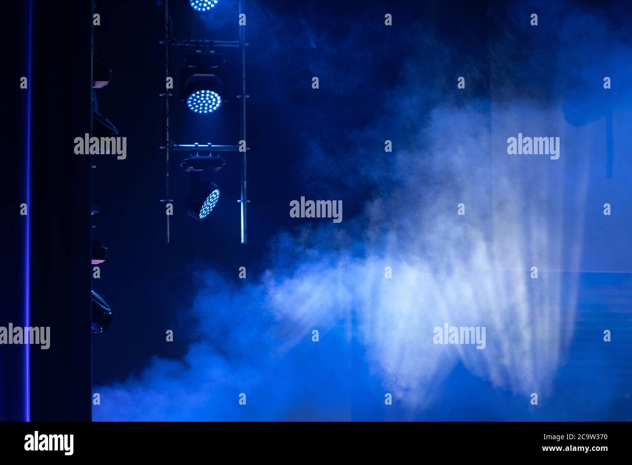 Theater stage with puffs of smoke, illuminated by stage light Stock ...