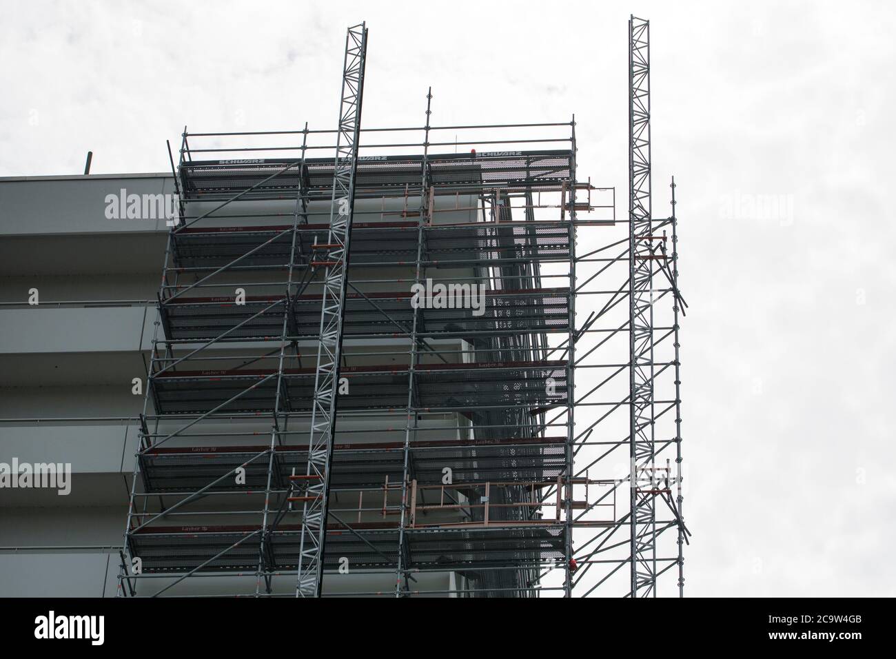 large tall building with scaffolding being renovated Stock Photo - Alamy